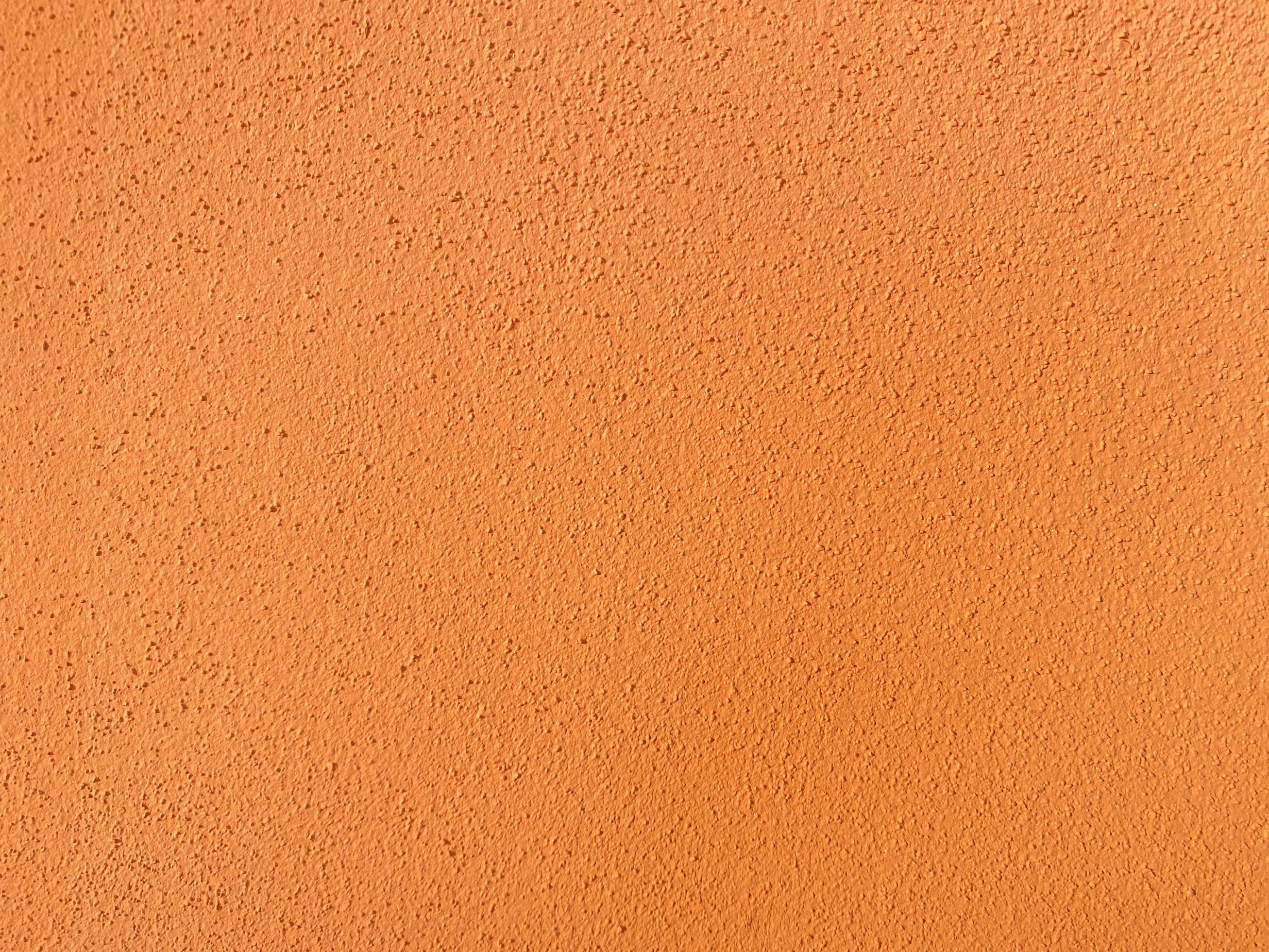 Seamless texture of orange cement wall a rough surface, with space for ... Seamless texture of orange cement wall a rough surface, with space for ...