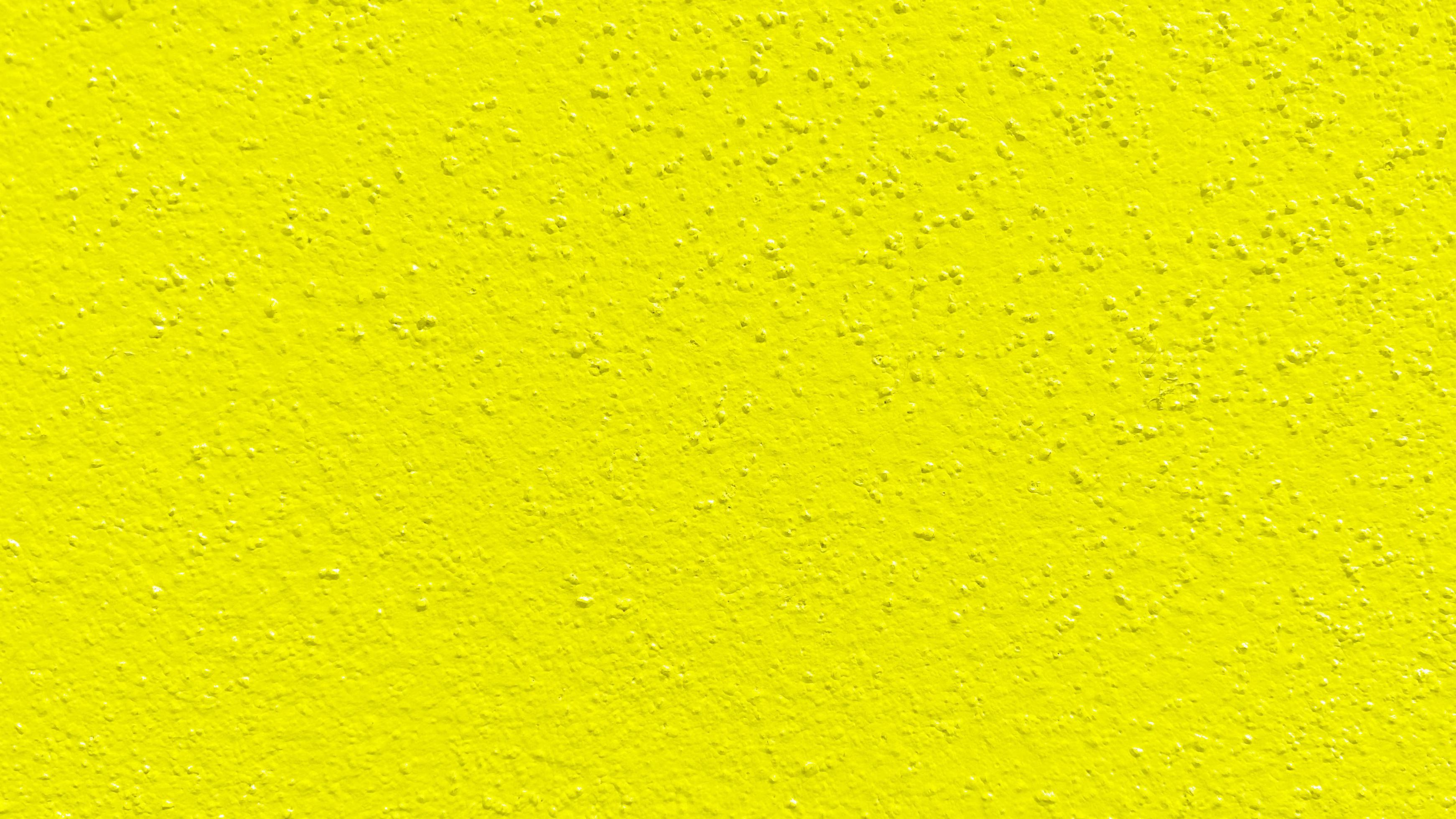 Seamless texture of yellow cement wall a rough surface, with space for ...
