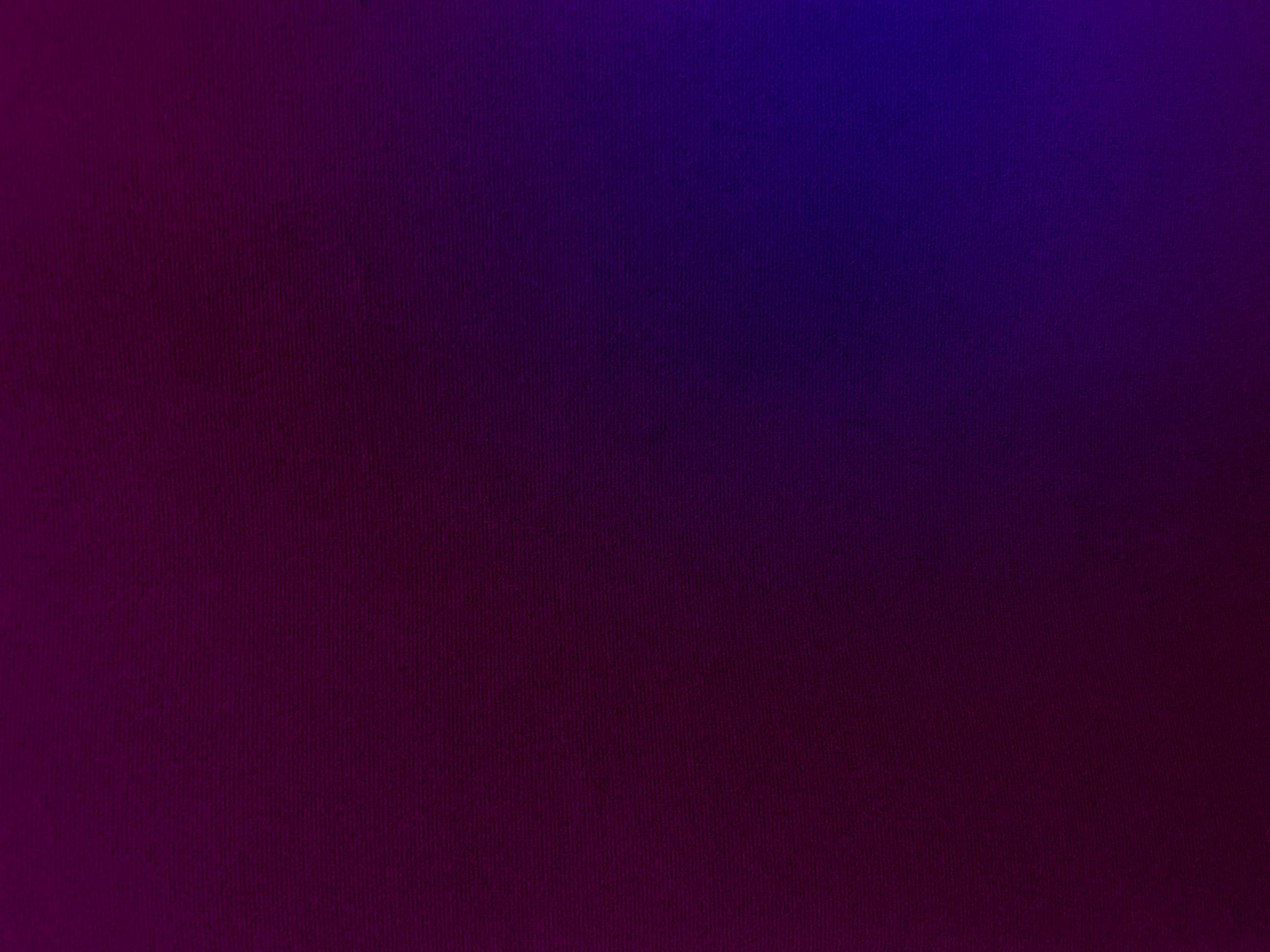 Purple gradient velvet fabric texture used as background. Empty purple ...