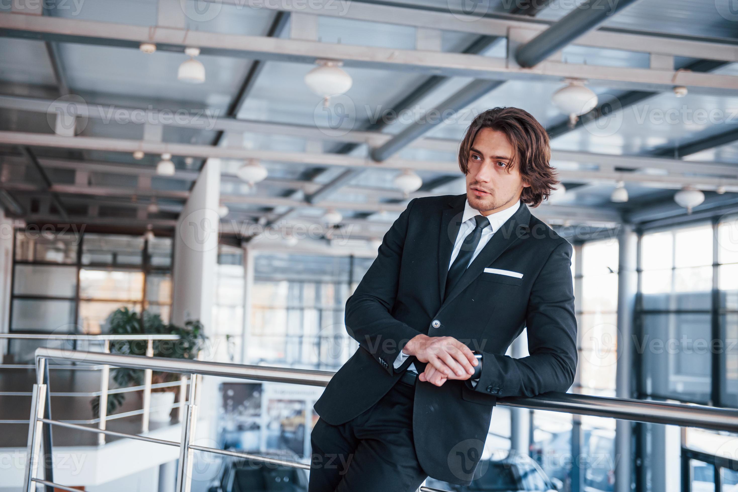 Portrait of handsome young businessman in black suit and tie 15243979 ...