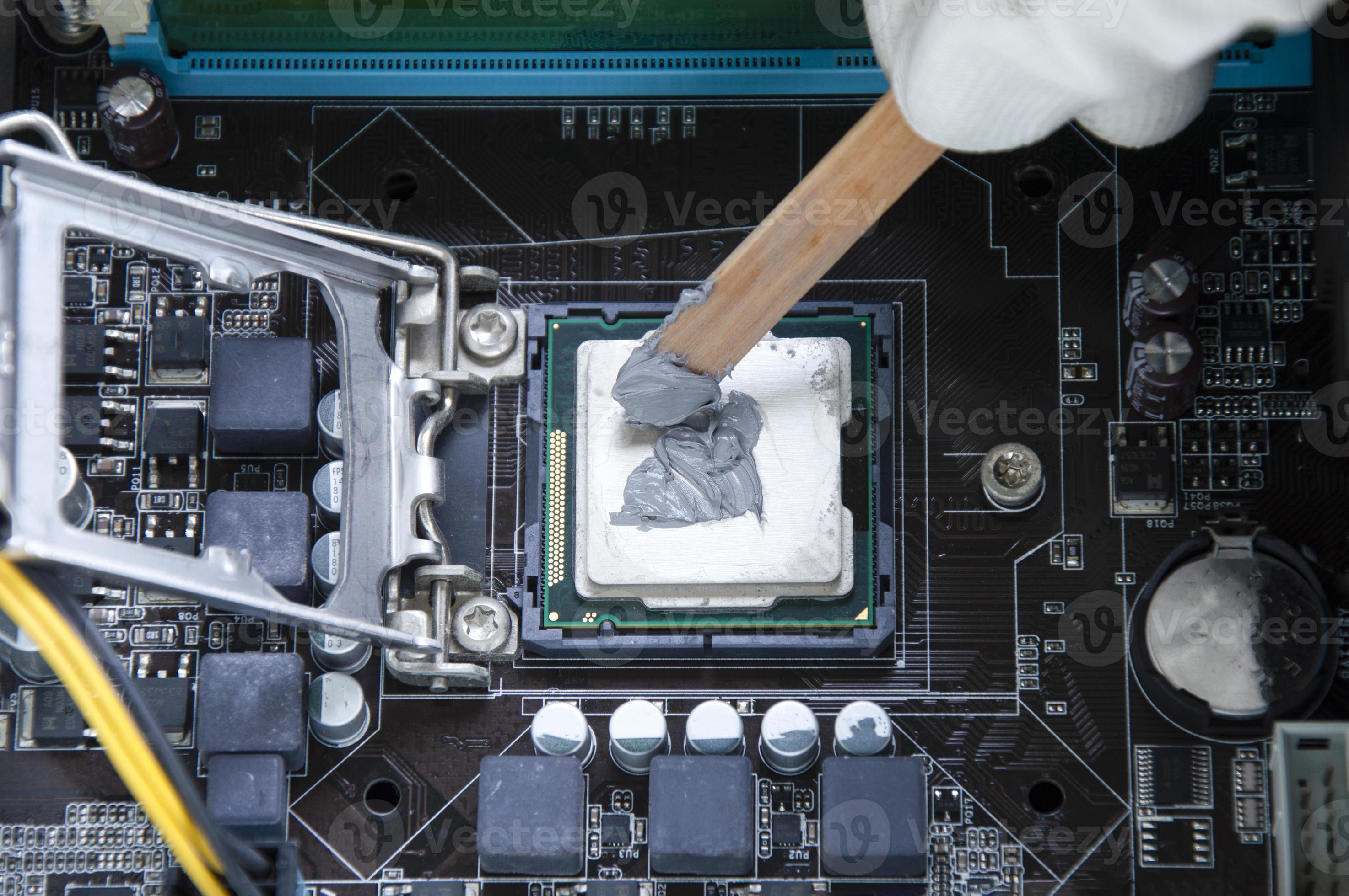 Top view Technician applying silicone Cooling on CPU chips 15247311 Stock Photo at Vecteezy