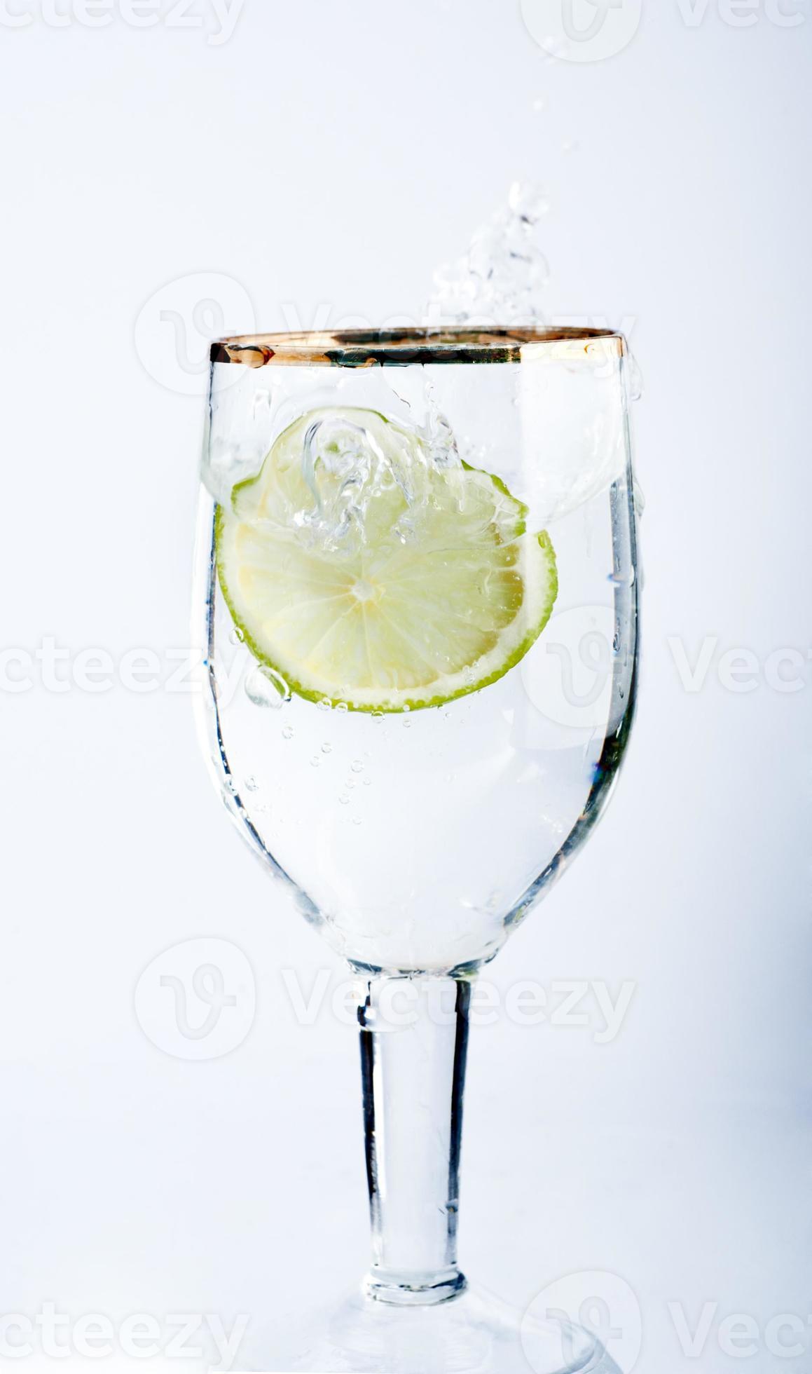 Lime splashing into glass of water 15252123 Stock Photo at Vecteezy