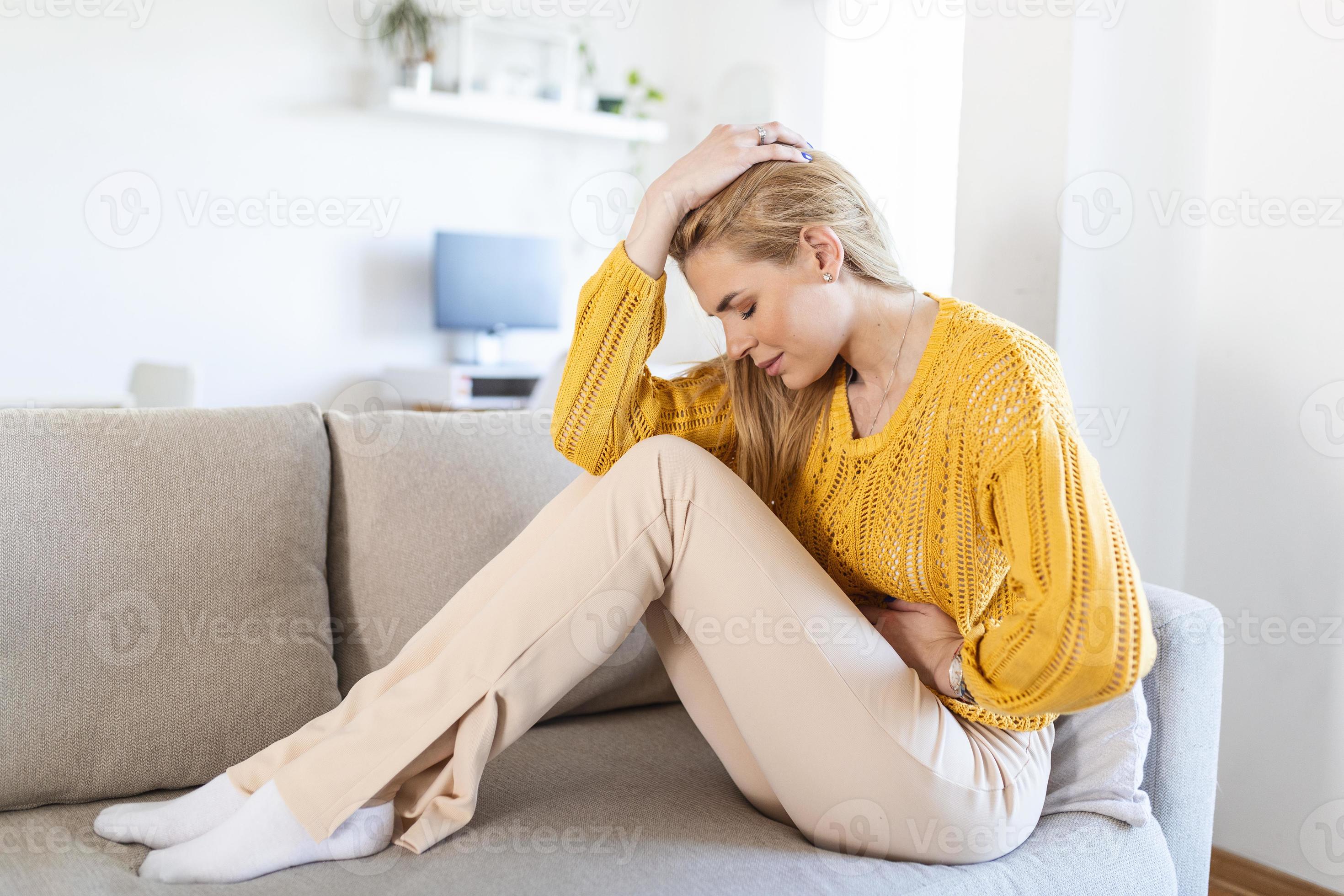 Woman Lying On Sofa Looking Sick In The Living Room Beautiful Young