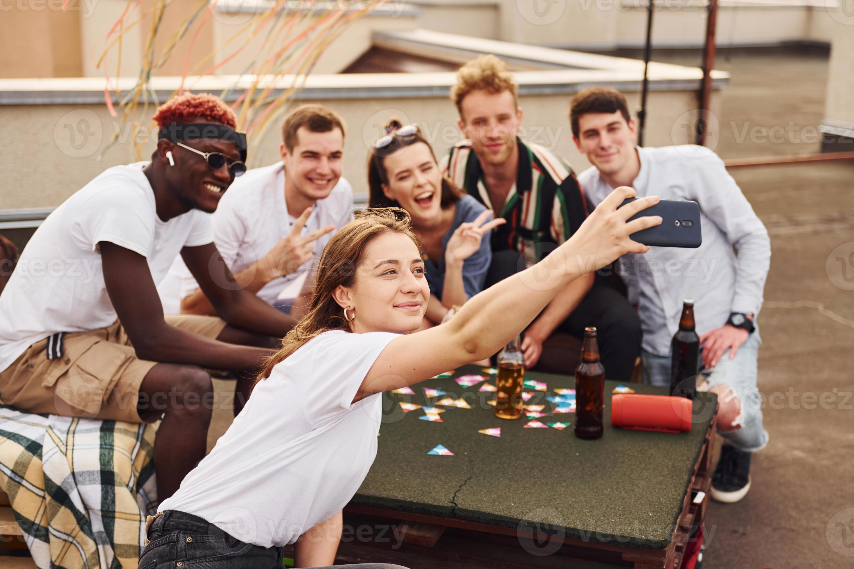 Girl Doing Photo When People Playing Card Game Group Of Young People In Casual Clothes Have A