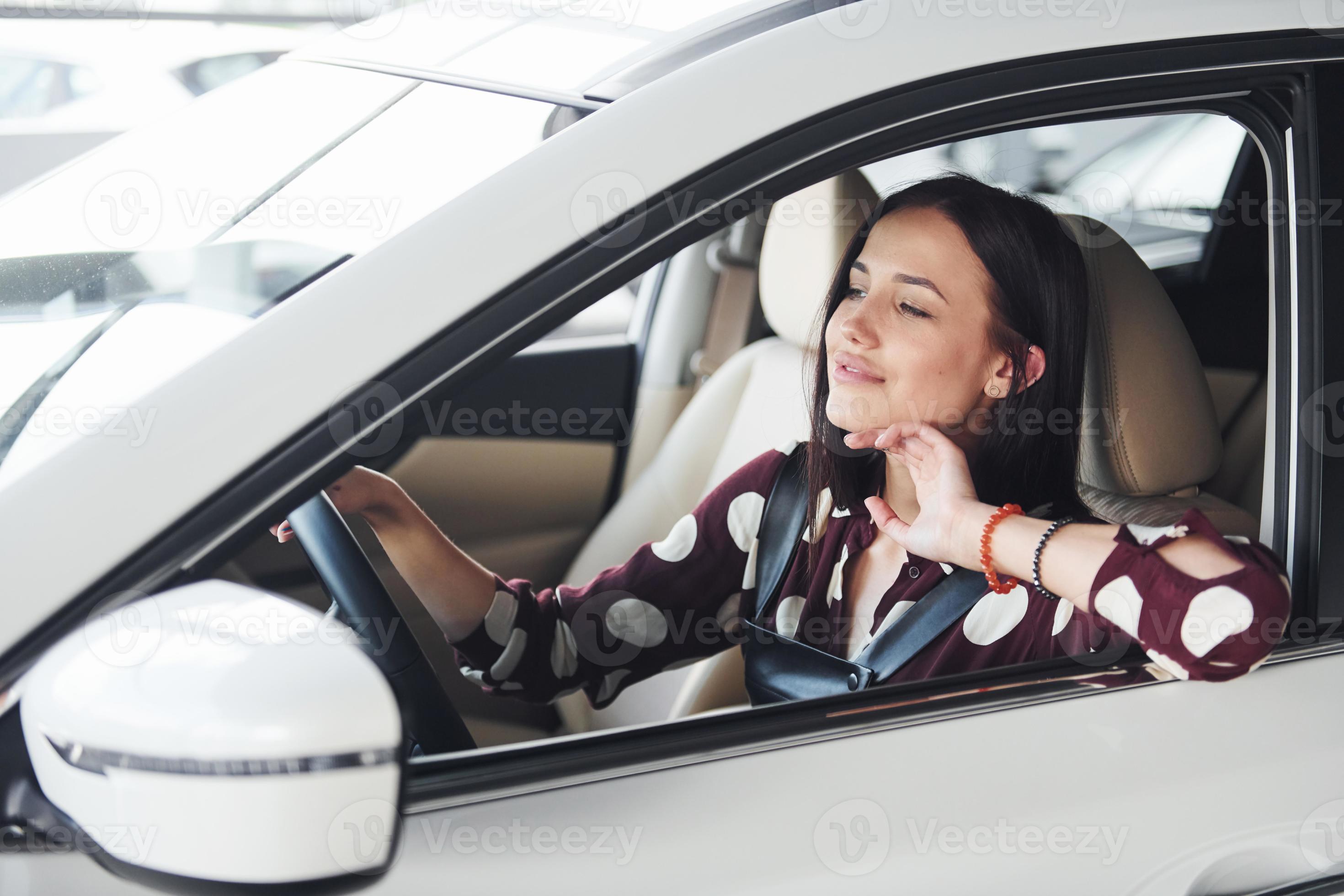 Side View Of Beautiful Young Brunette That Inside Of Modern Automobile