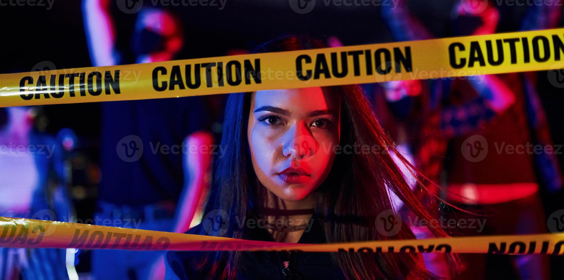 Beautiful woman near police border line. Group of protesting young ... Beautiful woman near police border line. Group of protesting young ...