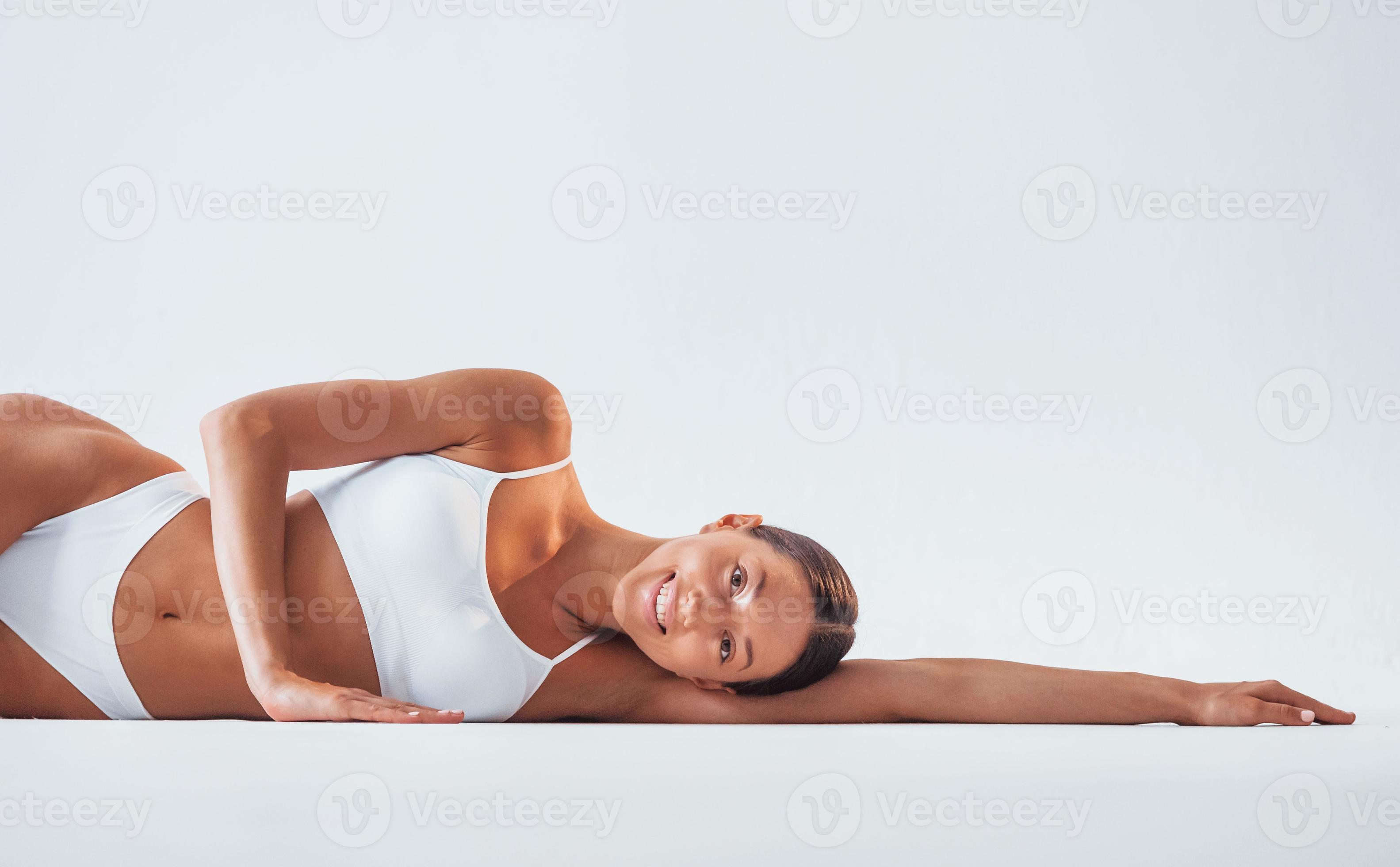Lying Down On The Floor Beautiful Woman With Slim Body In Underwear Is