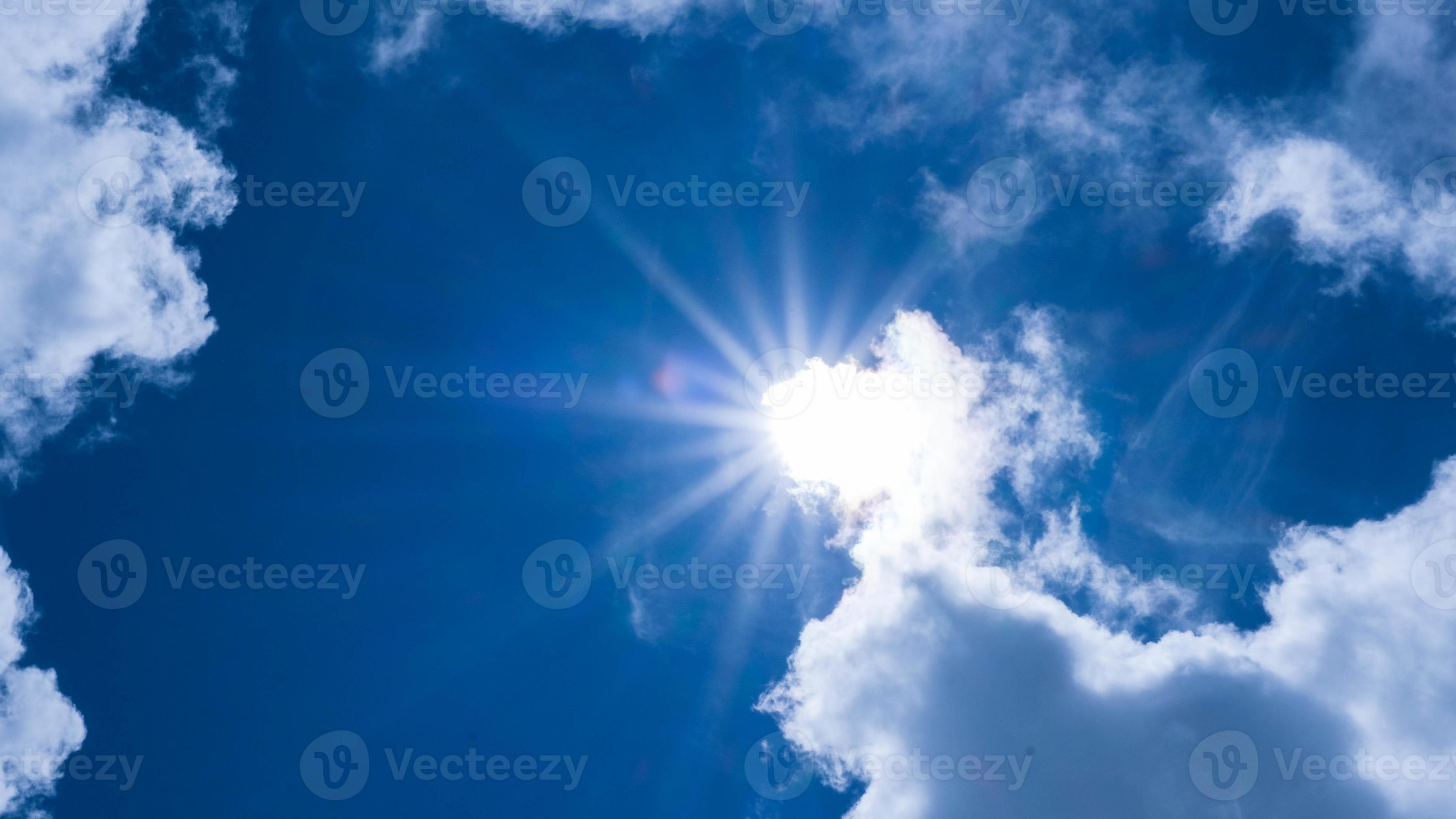 Aerial view of beautiful sky with clouds and sun on a summer day. Time lapse of clouds above the ...