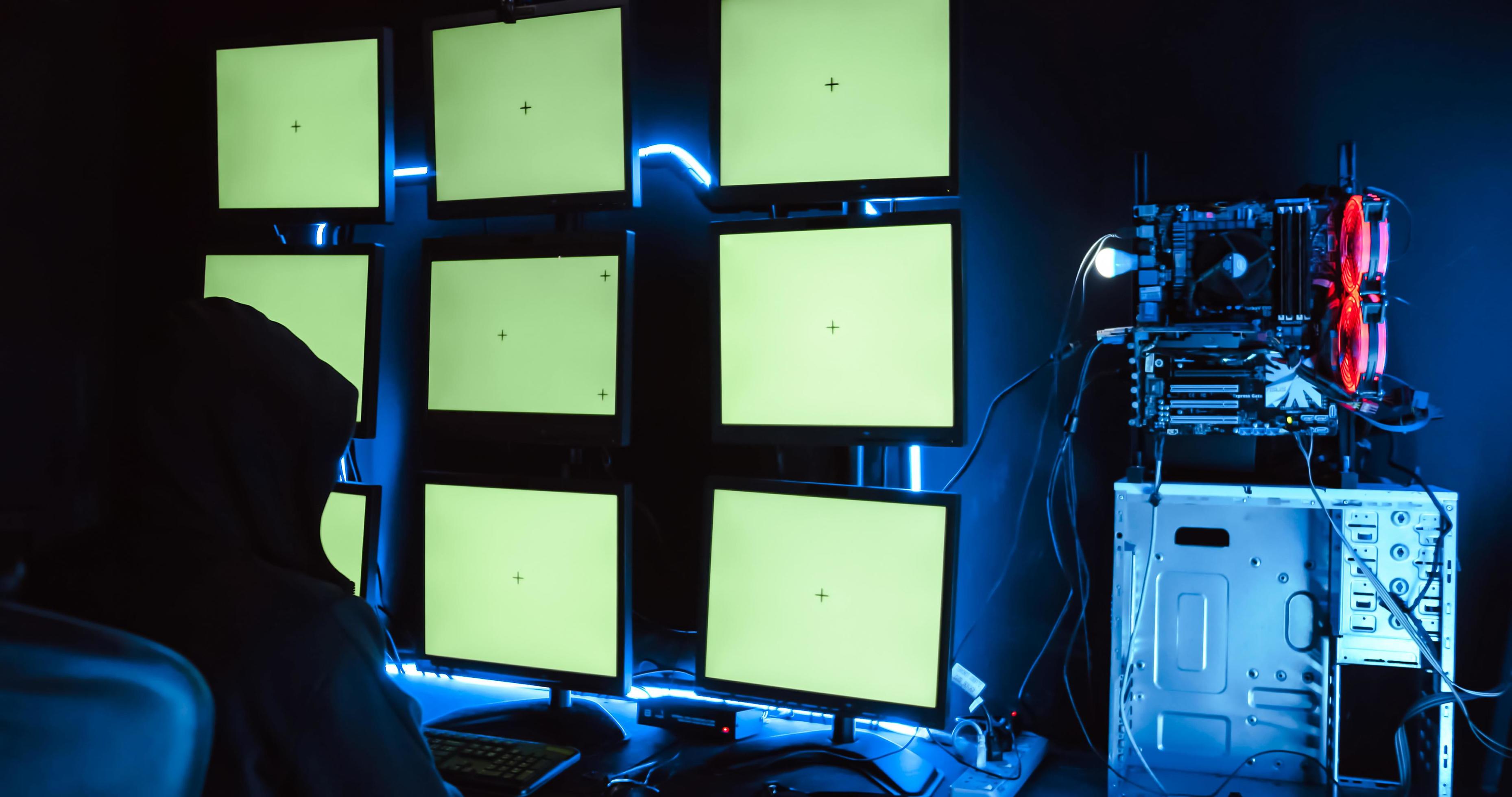 A Male Hacker Is Using A Computer To Hack Data To Demand Ransom From Victims 15603307 Stock