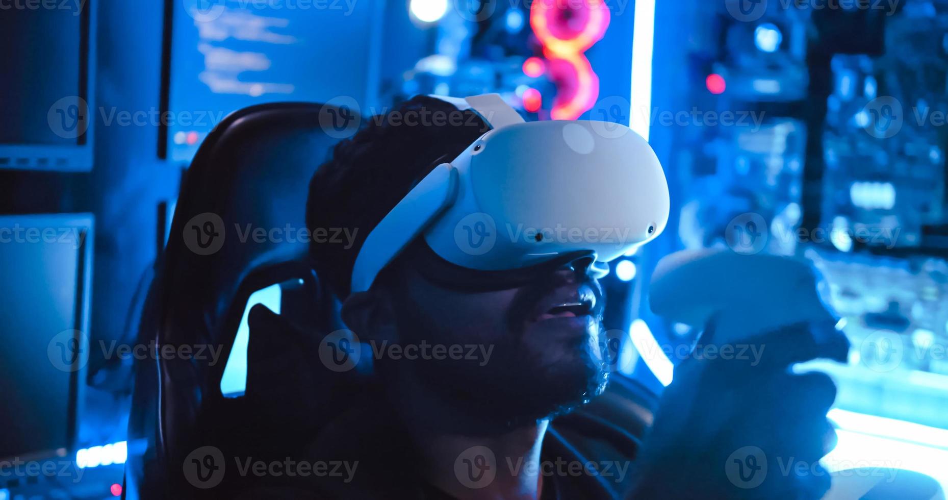 A Hacker Wearing Virtual Reality Glasses Is Using Computer To Hack Data To Get Ransom From