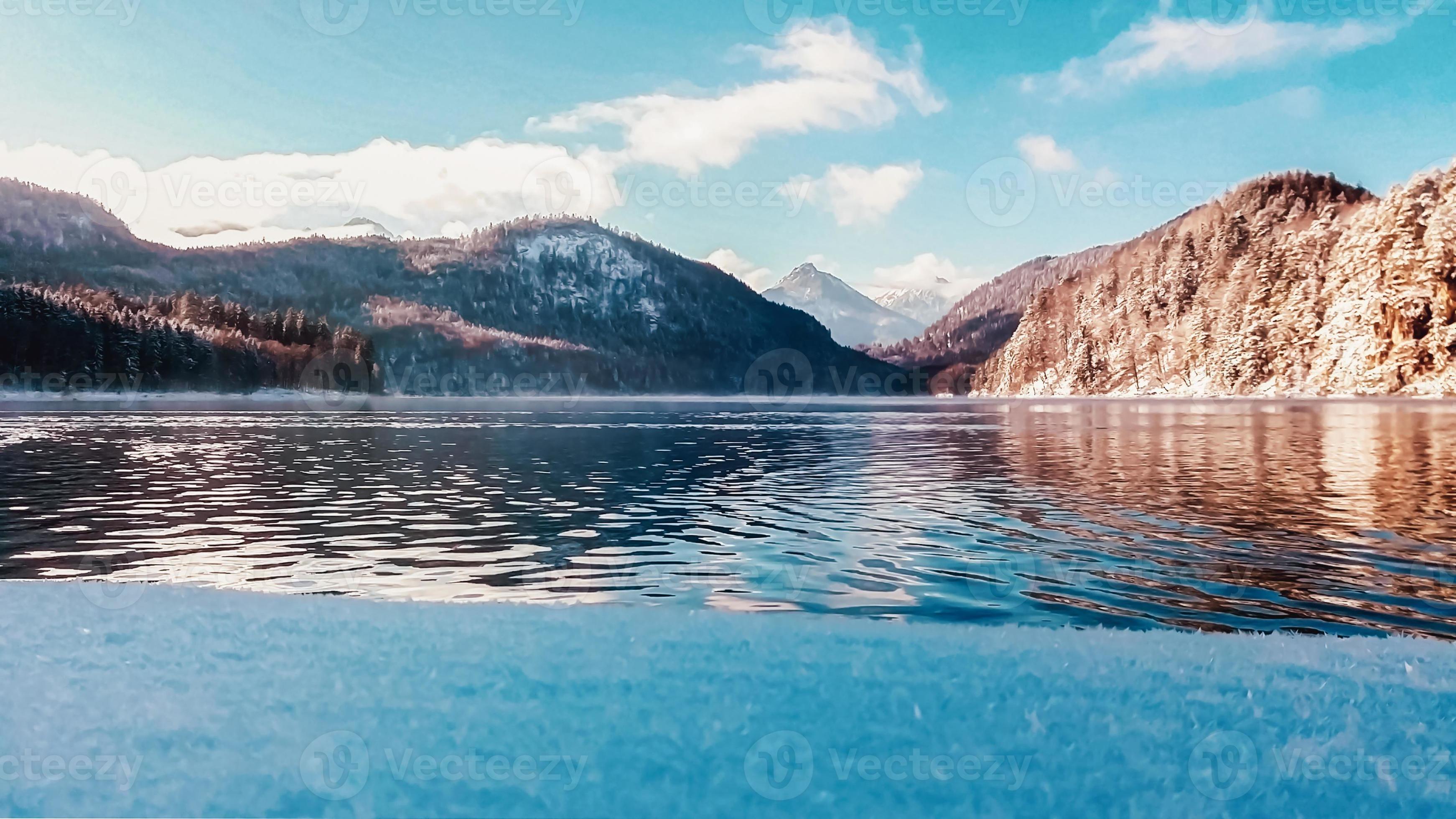 Mountain lake in winter, snow and water, golden hour light 15617257 Stock Photo at Vecteezy