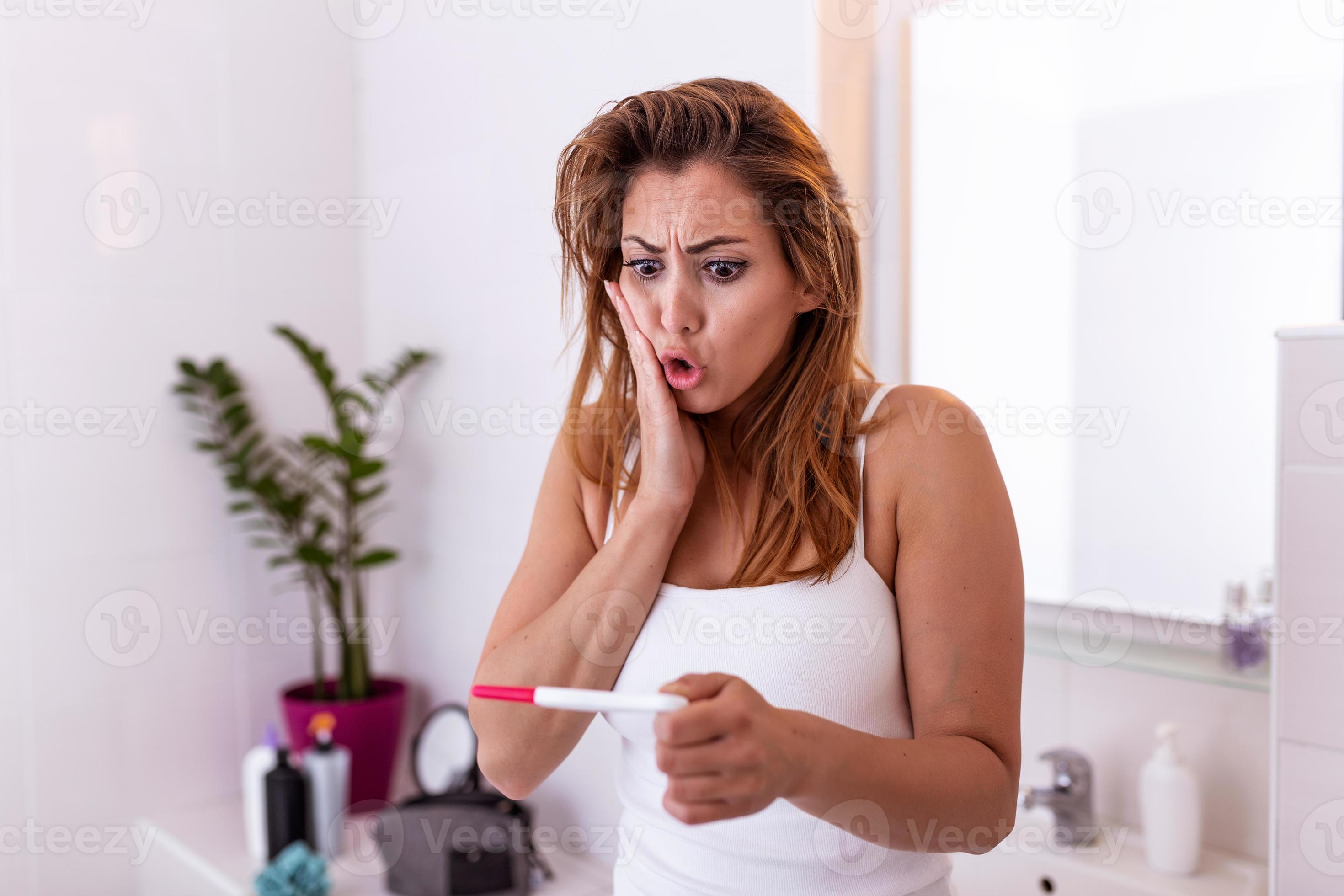 Shocked Woman Looking At Control Line On Pregnancy Test Shocked Young