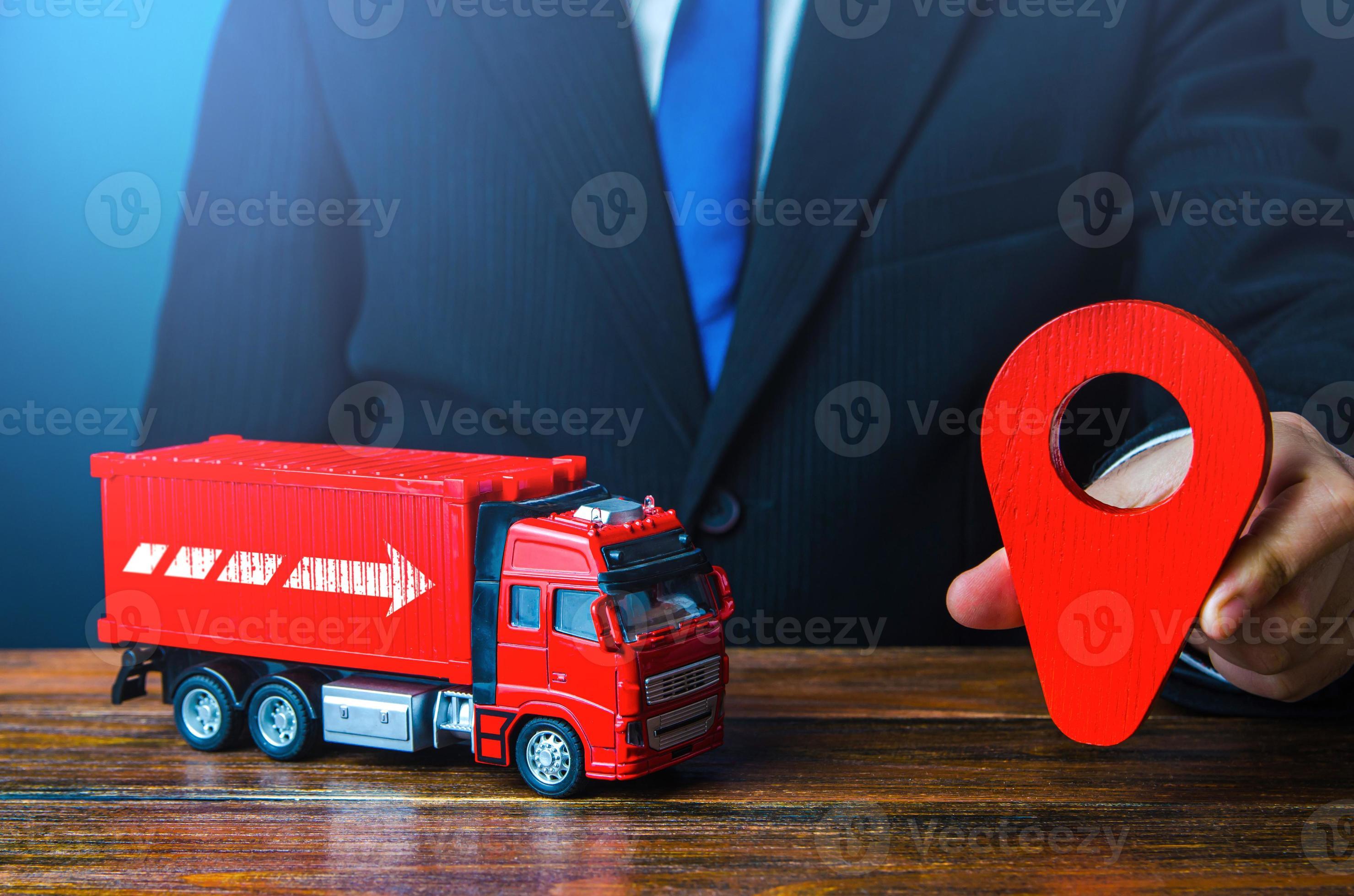Businessman sets destination of cargo transportation. Transport service ... Businessman sets destination of cargo transportation. Transport service ...