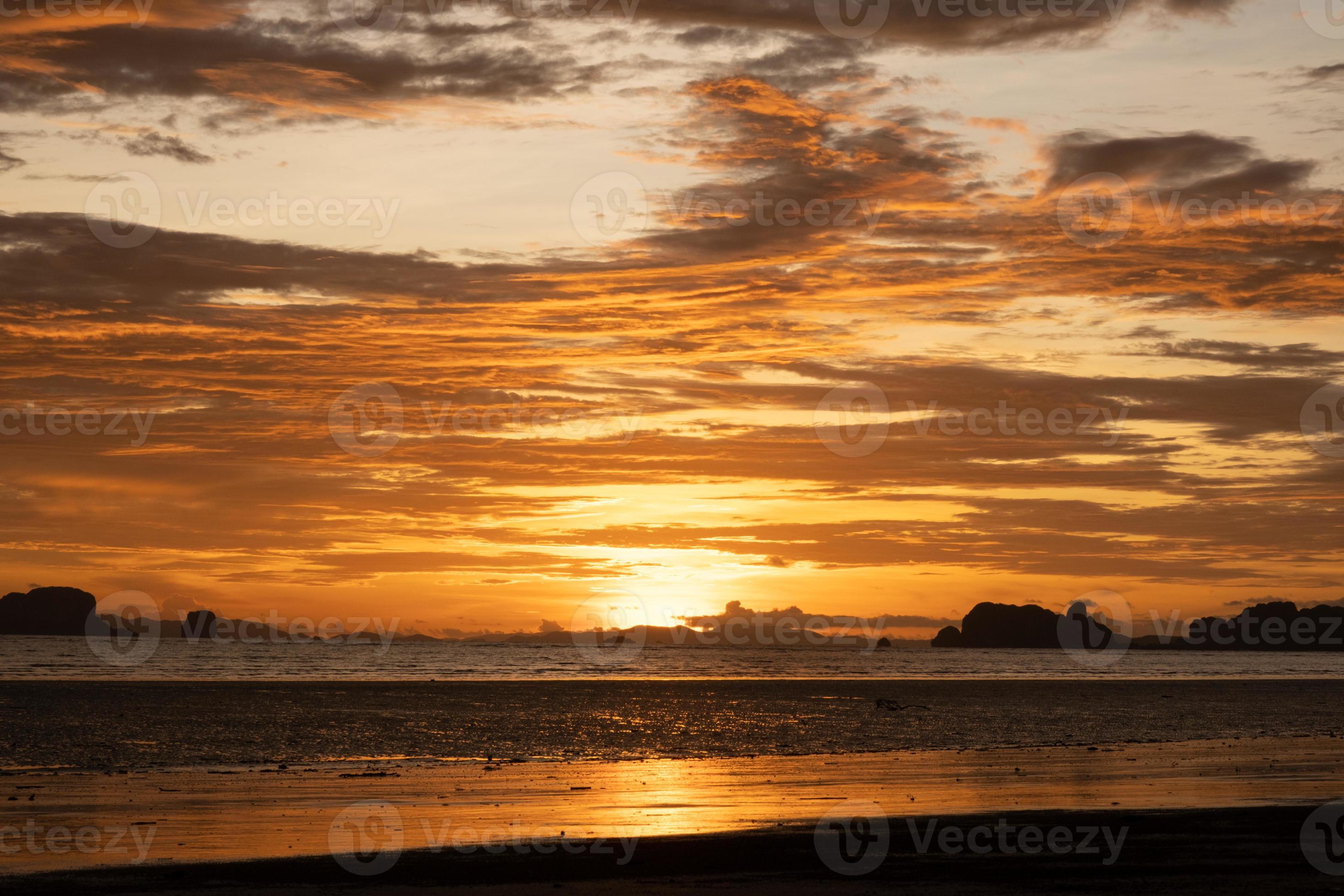 Clouds on the sky reflection of sun in the water and sand on beach 15687333 Stock Photo at Vecteezy