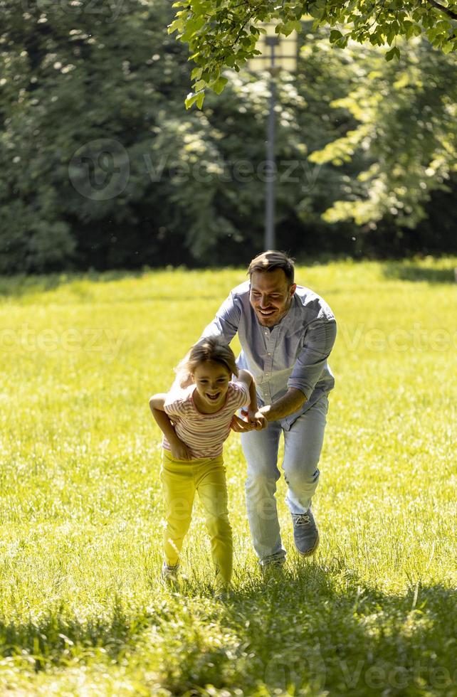 Father With Daughter Having Fun On The Grass At The Park 15705855 Stock