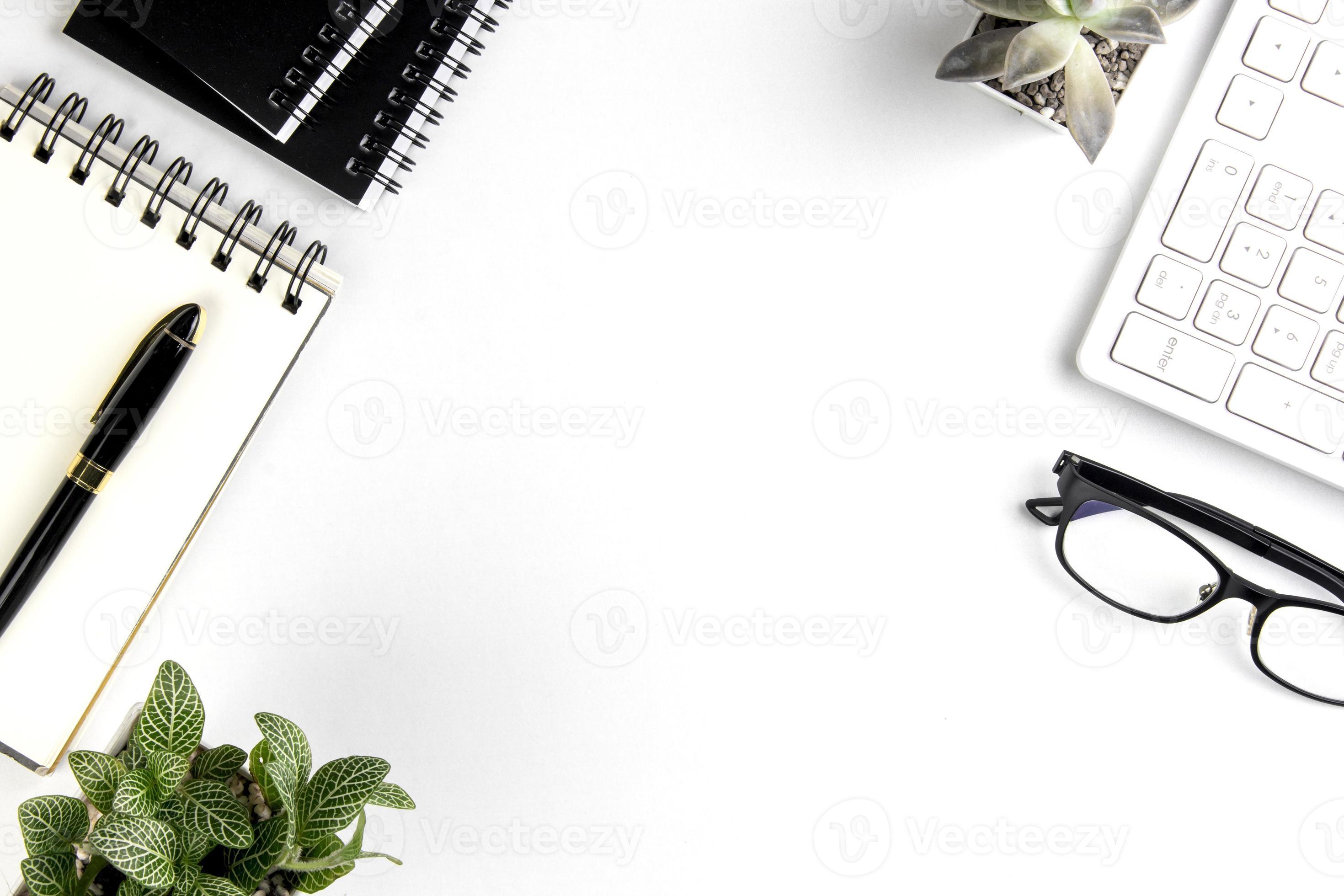 Top View Of Modern White Office Desk With Computer Keyboard Blank Notebook Page And Other