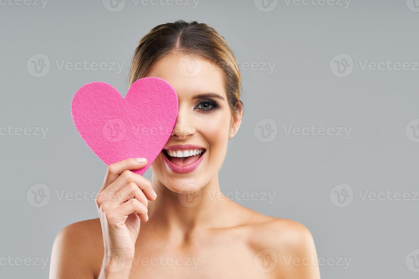 Beautiful Adult Woman Posing Over Gray Background With Heart 15856685
