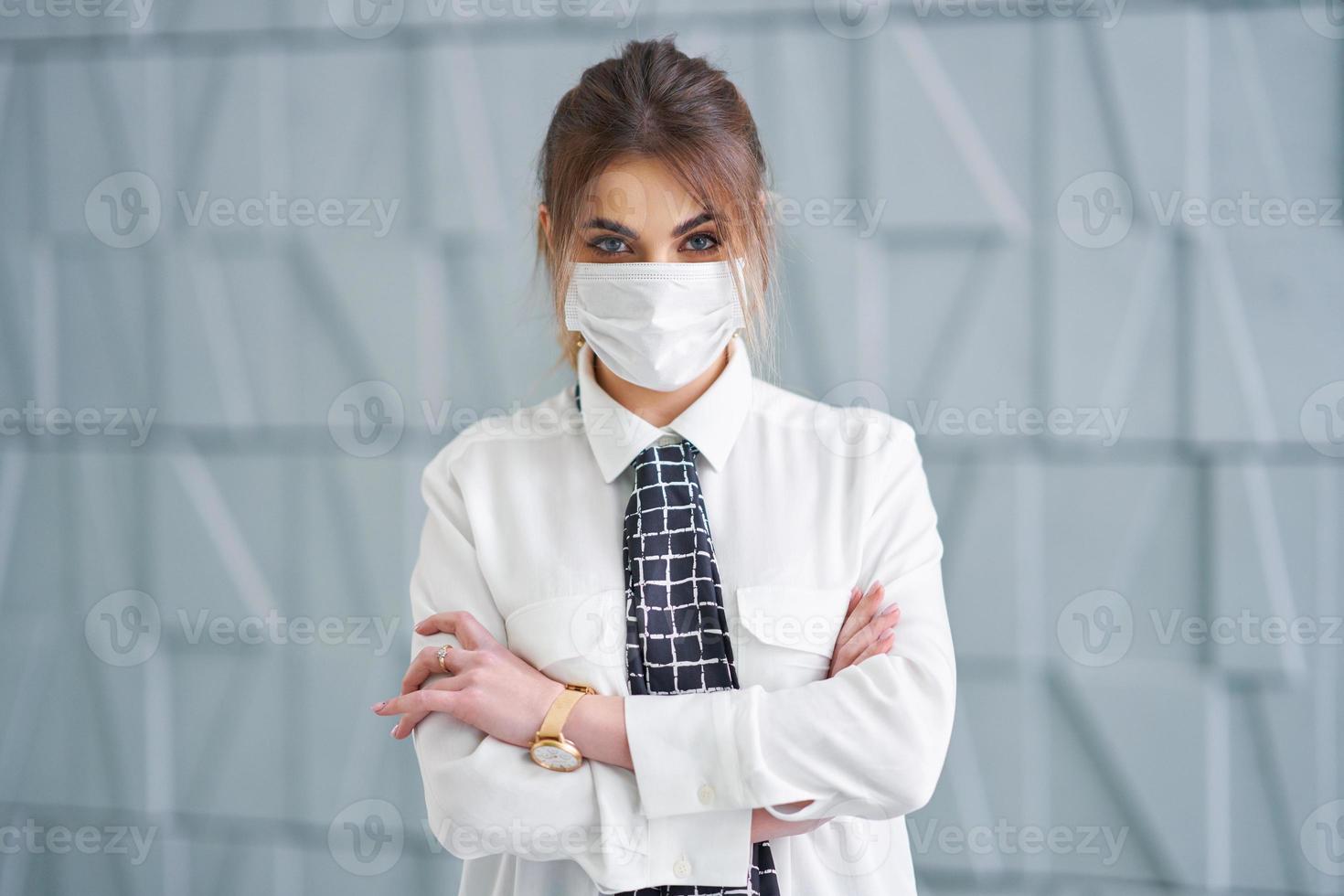 Businesswoman Wearing Mask Posing Over Modern Background 15866668 Stock