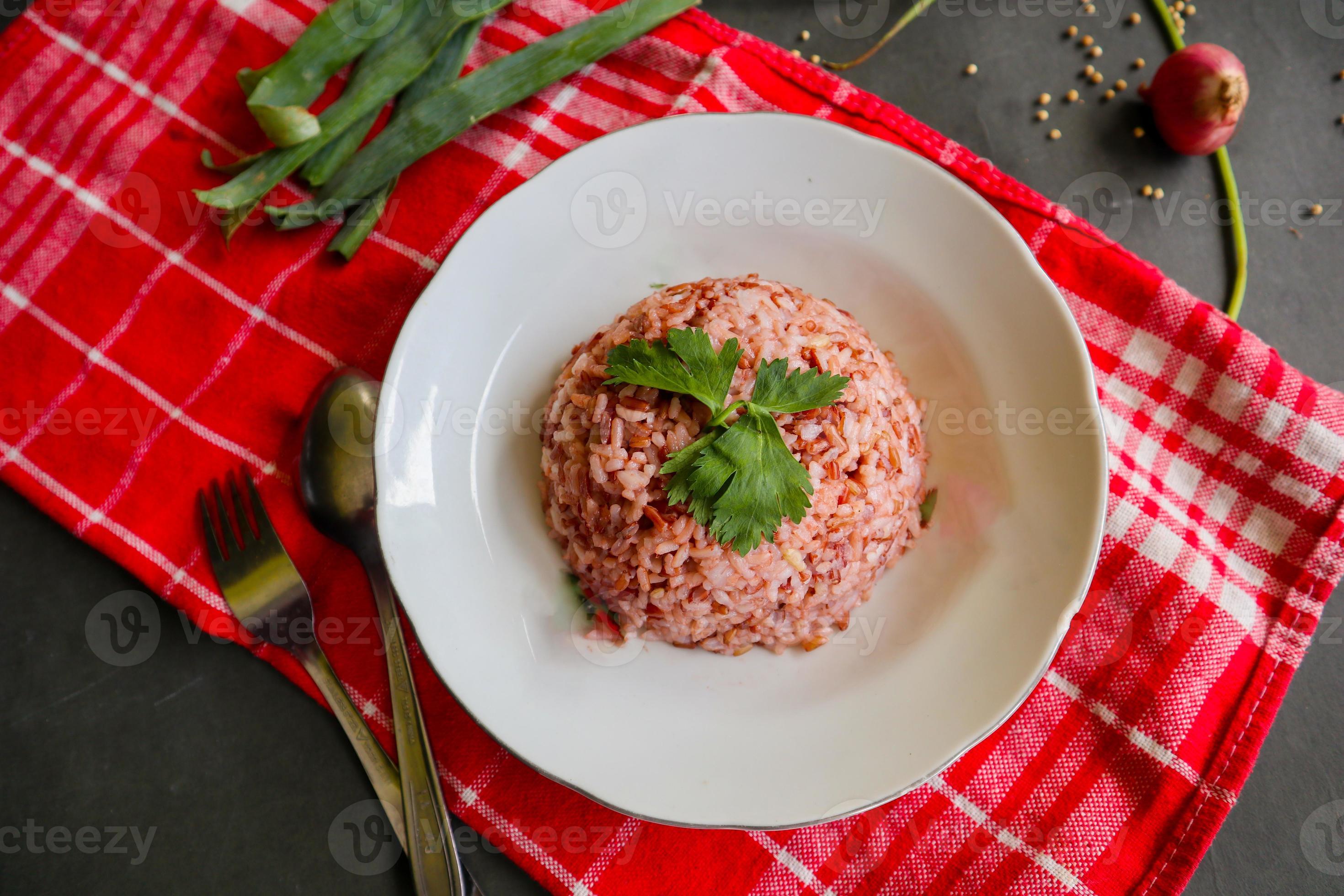 Red steamed rice or nasi merah served in plate isolated on black background 15939796 Stock Photo ...