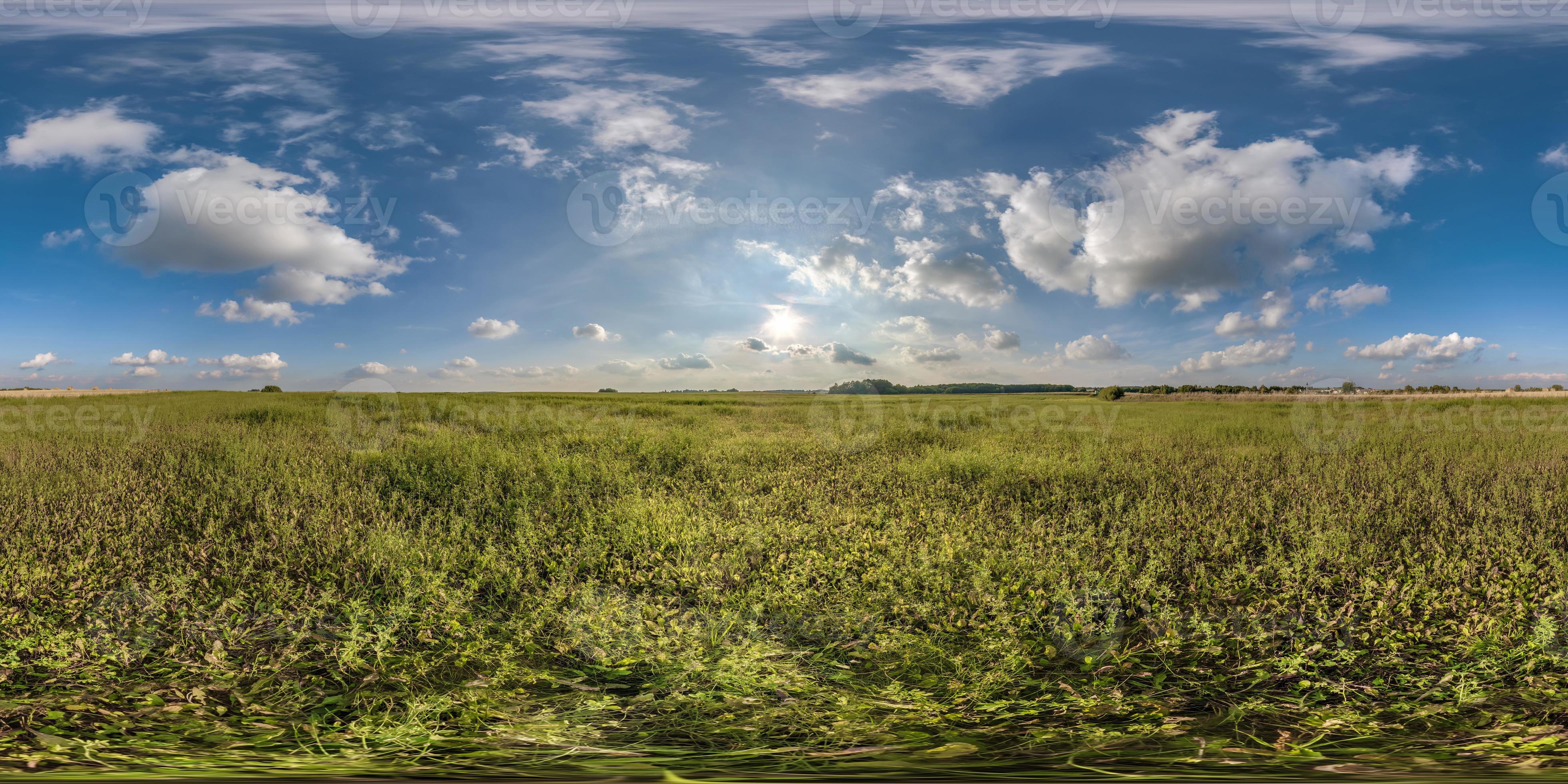 full seamless 360 hdri panorama view among farming field with sun and clouds in overcast sky in ...