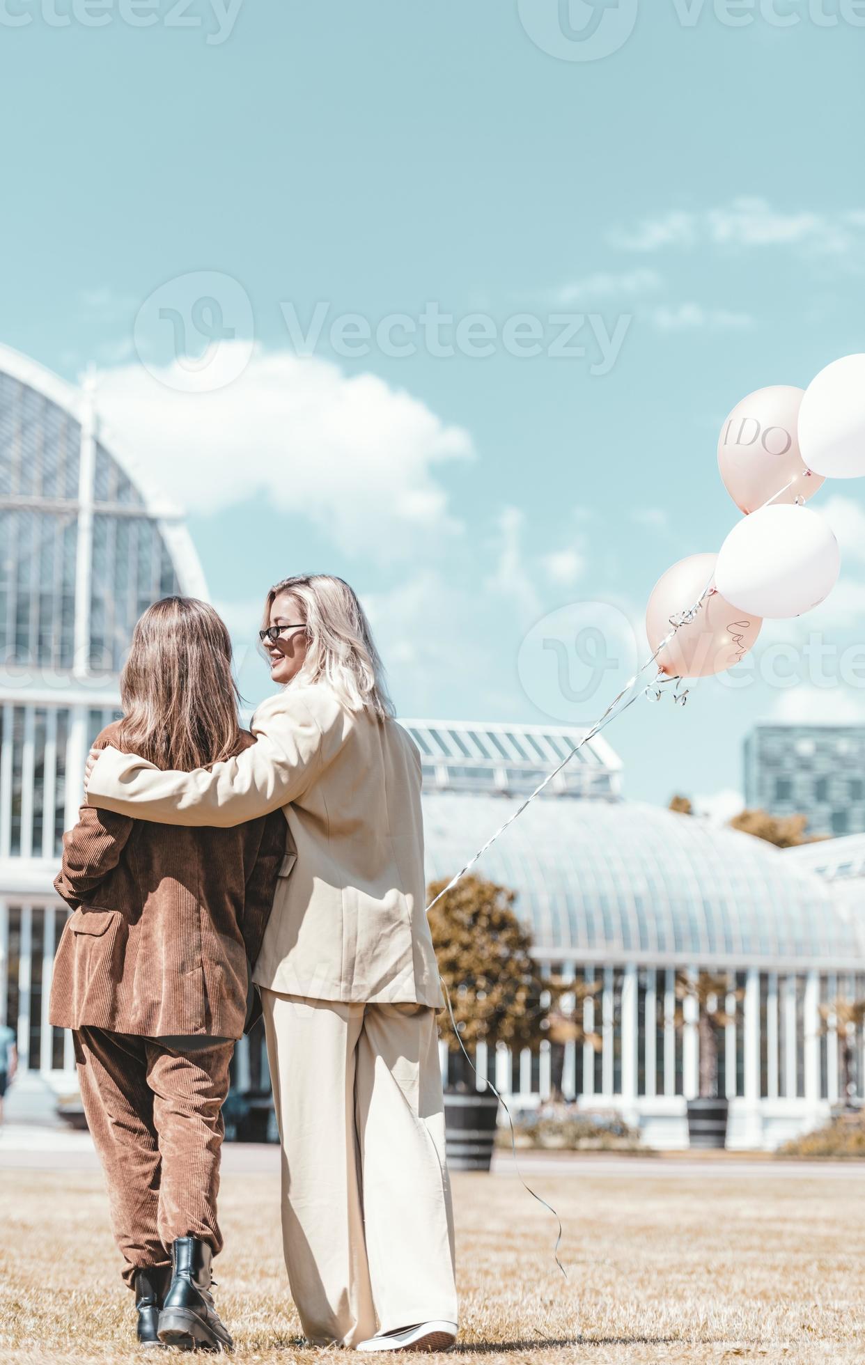 Lgbt Lesbian Couple Love Moments Lesbian Couple Holding Balloons In