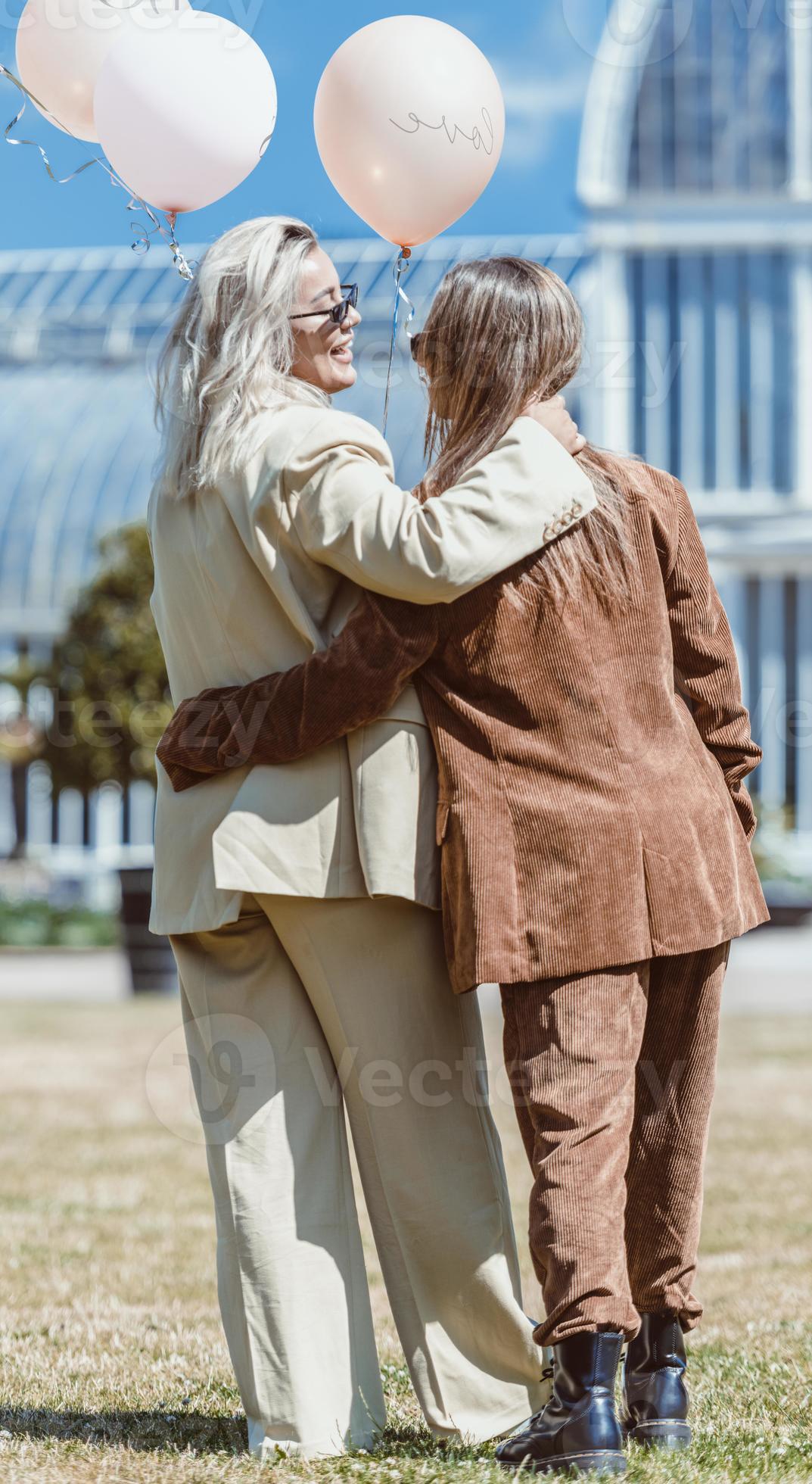 Lgbt Lesbian Couple Love Moments Lesbian Couple Holding Balloons In