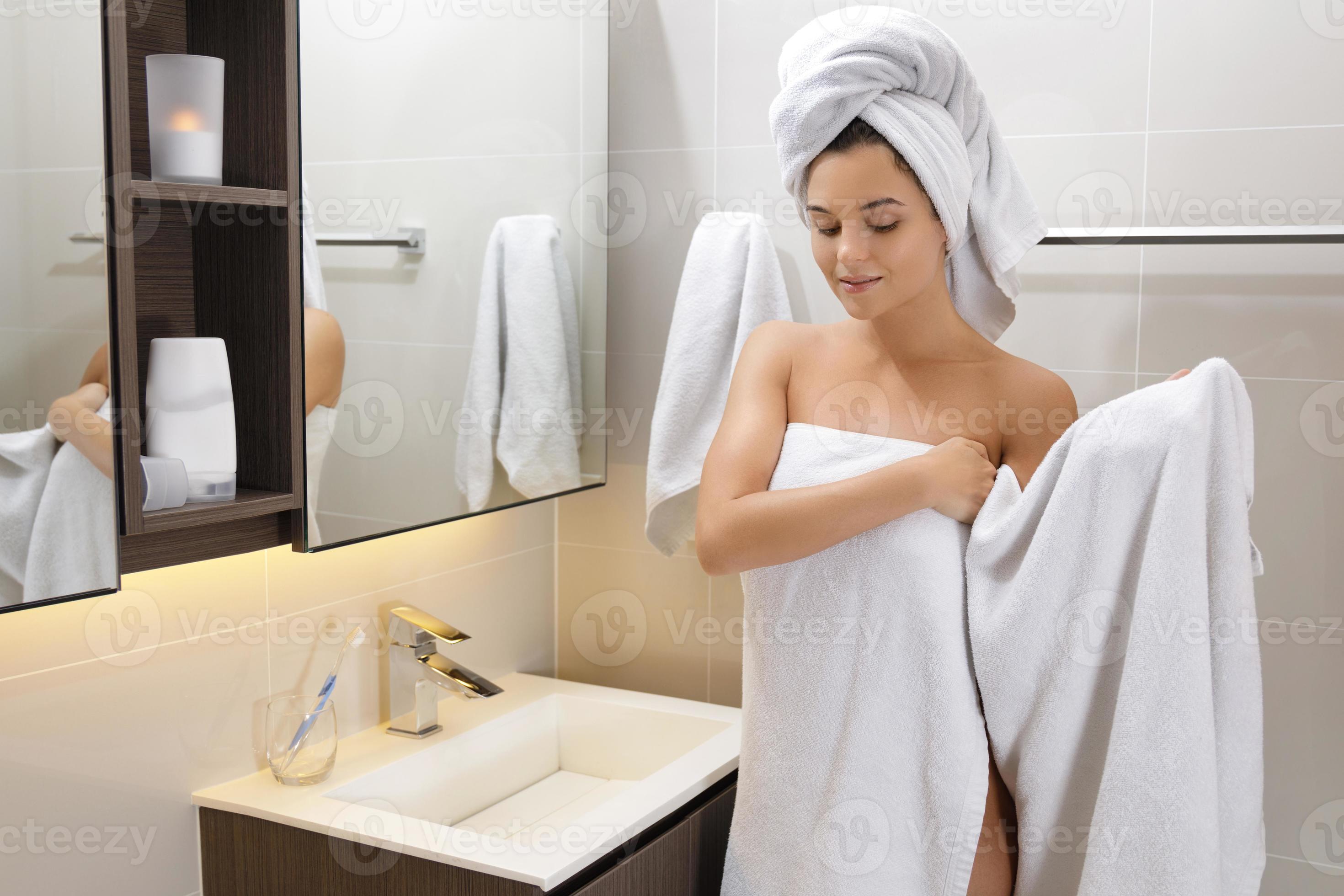 Beautiful woman wrapped in the towel after shower 16115522 Stock Photo at Vecteezy