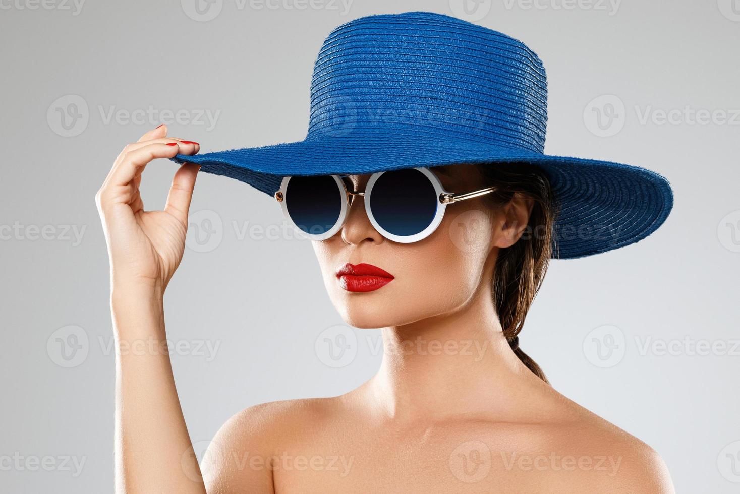 Beautiful Woman Wearing Blue Hat And Sunglasses Is Ready For Vacation