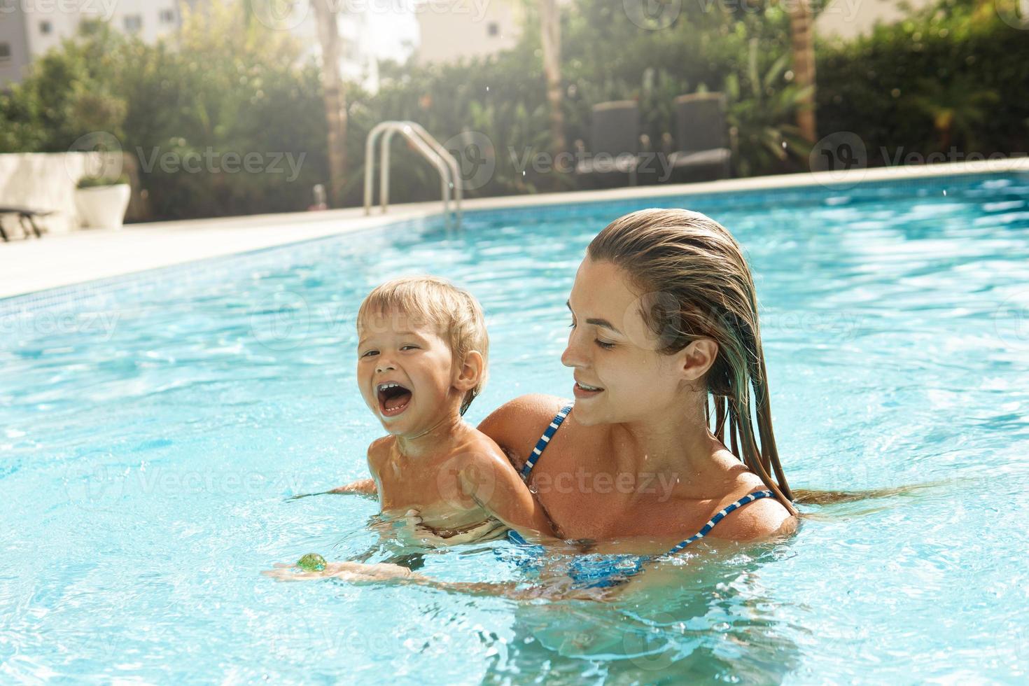 Mother and her cute little son swimming in outdoor pool during summer vacation 16253676 Stock ...