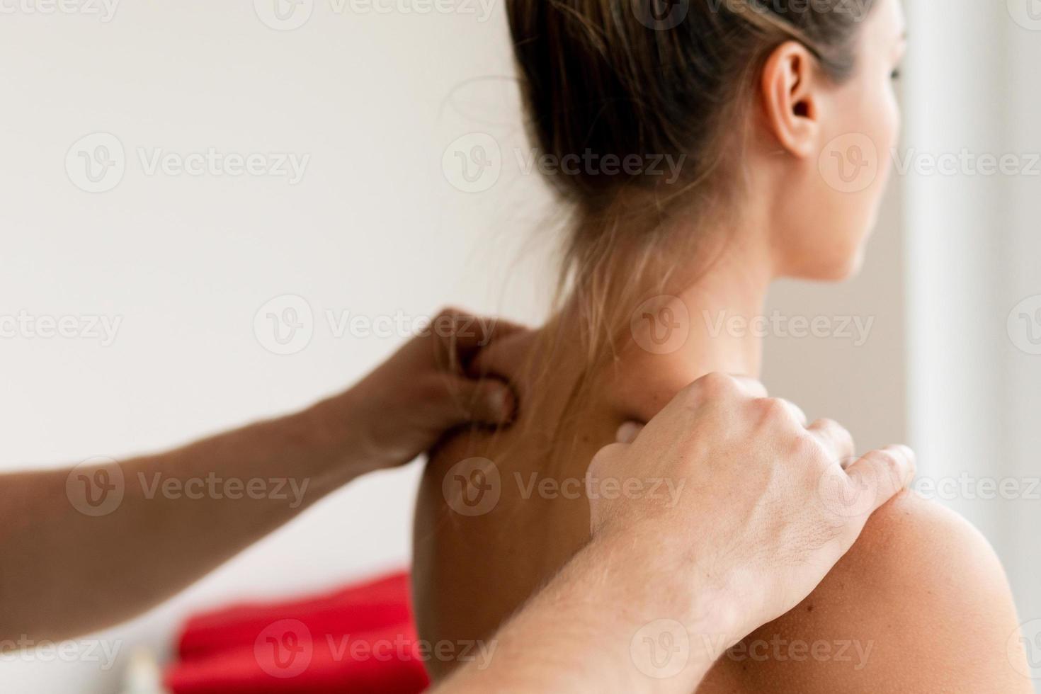 Closeup Of Masseur Mans Hands During Back Massage For Young Woman