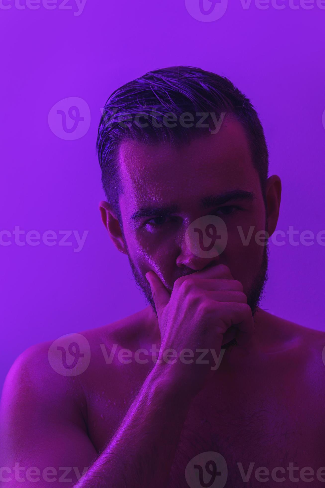Handsome young man with wet skin in ultraviolet light 16288887 Stock Photo at Vecteezy
