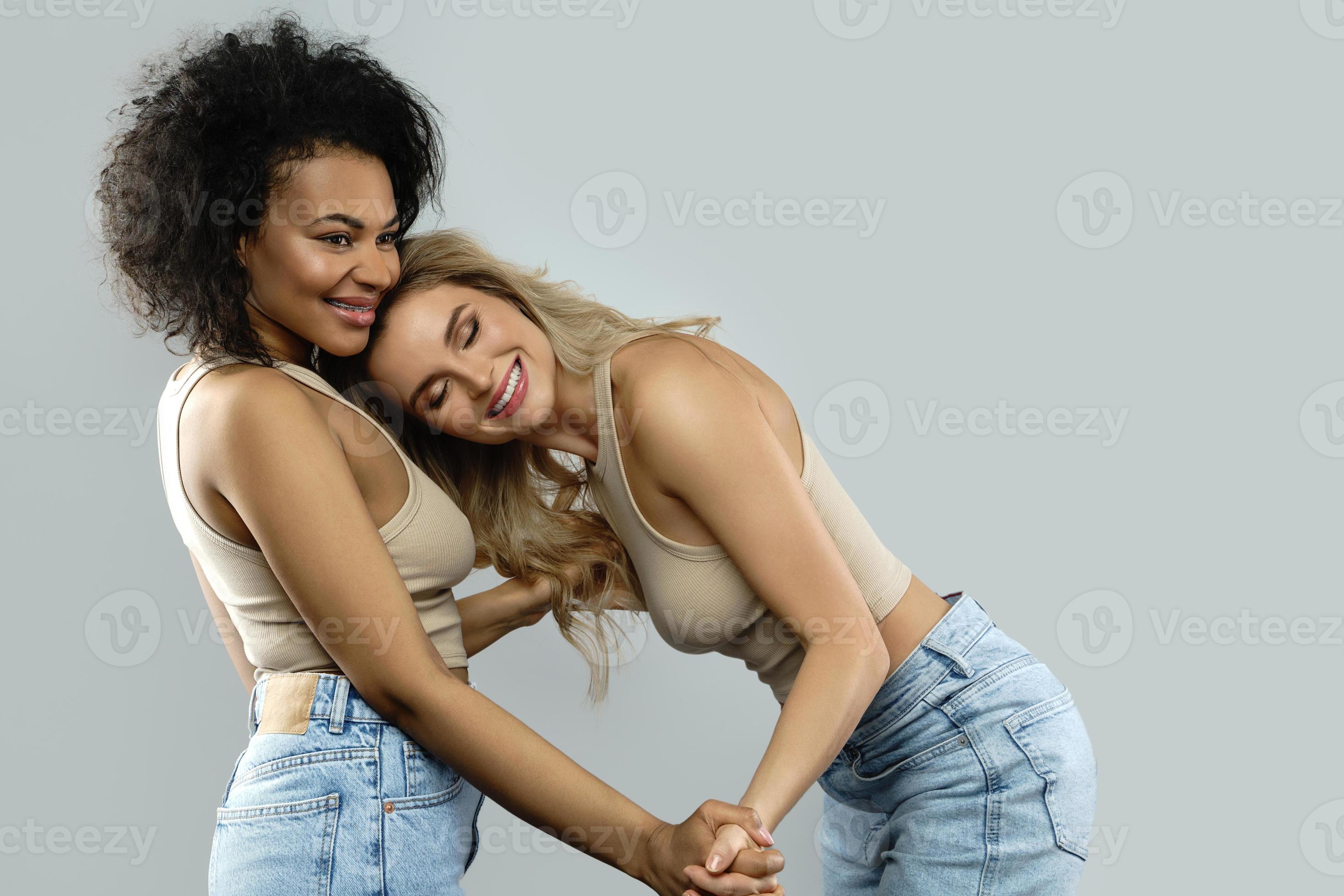 Caucasian And African American Women Holding Hands Concepts