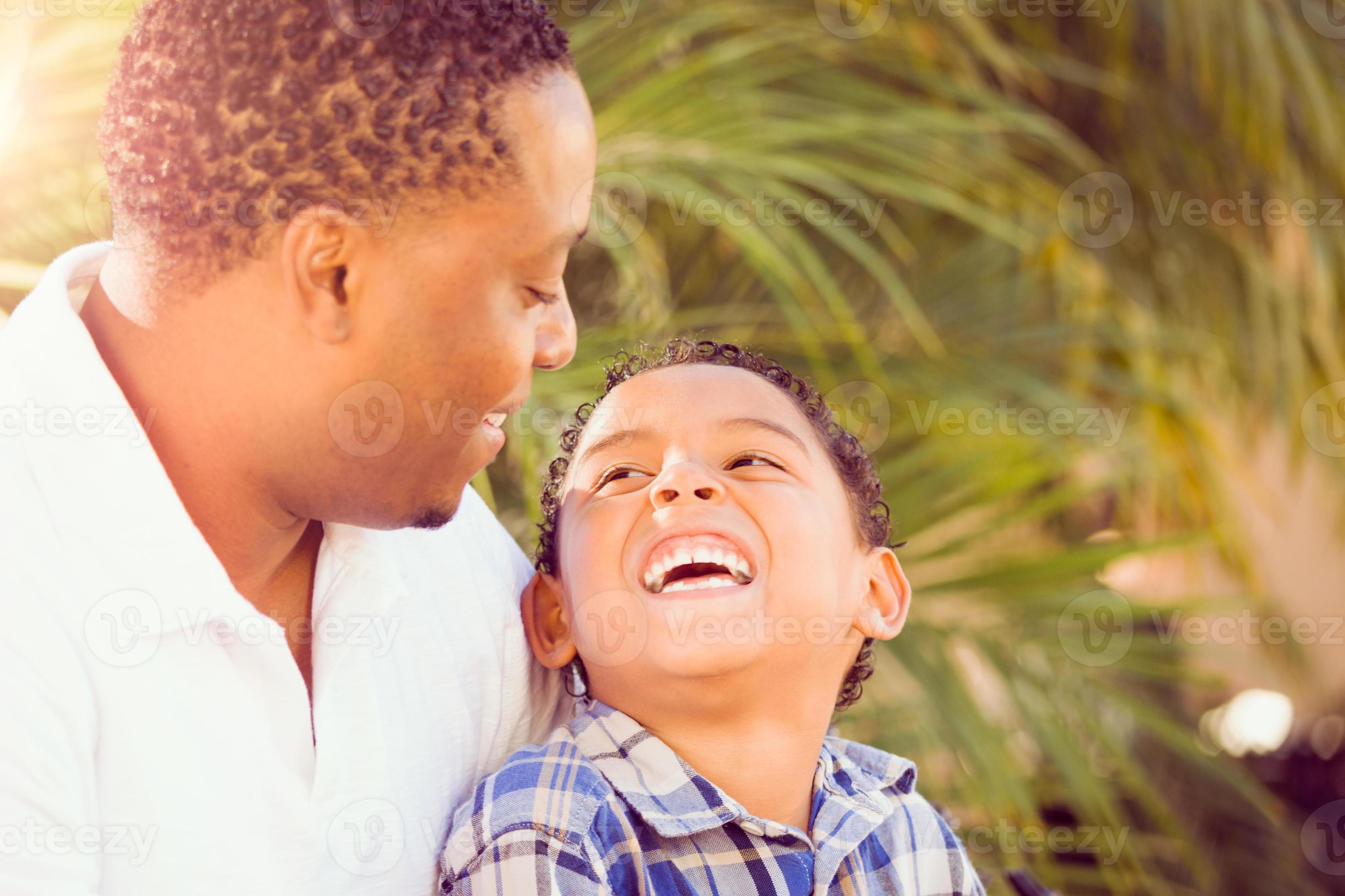 Mixed Race Son And African American Father Playing Outdoors Together