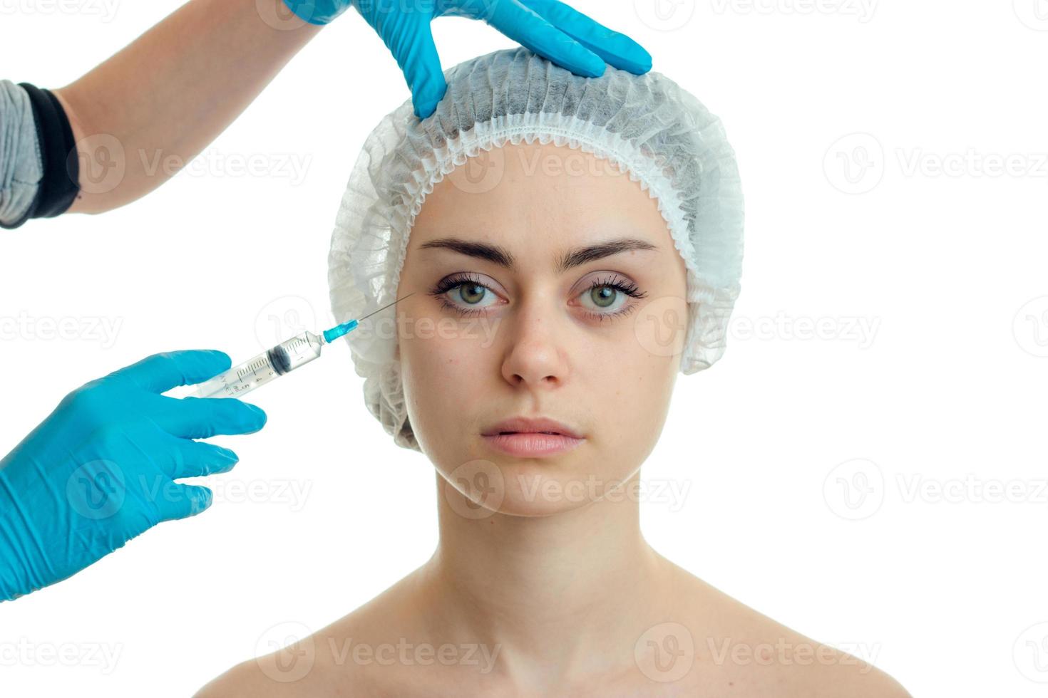 woman makes prick in face plastic surgeon 16347758 Stock Photo at Vecteezy