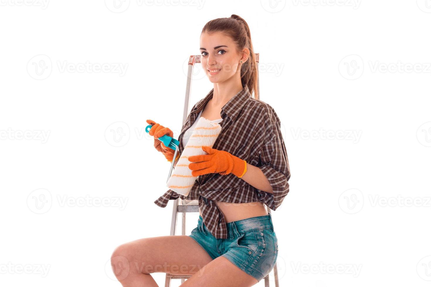 beautiful brunette woman builder makes renovation isolated on white ... beautiful brunette woman builder makes renovation isolated on white ...