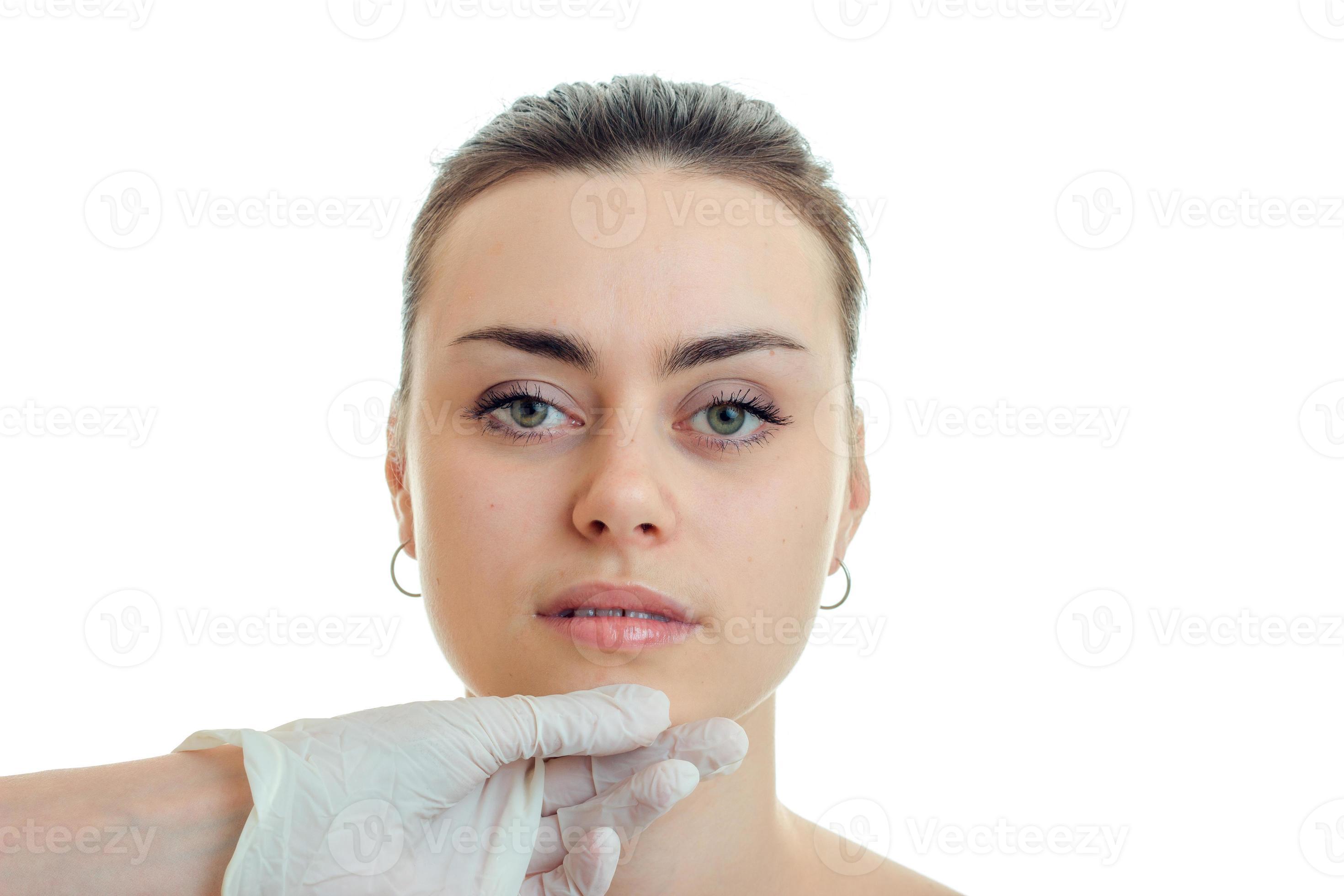 Portrait Of Beautiful Serious Girl Without Makeup That Looks Directly At The Doctor Close Up
