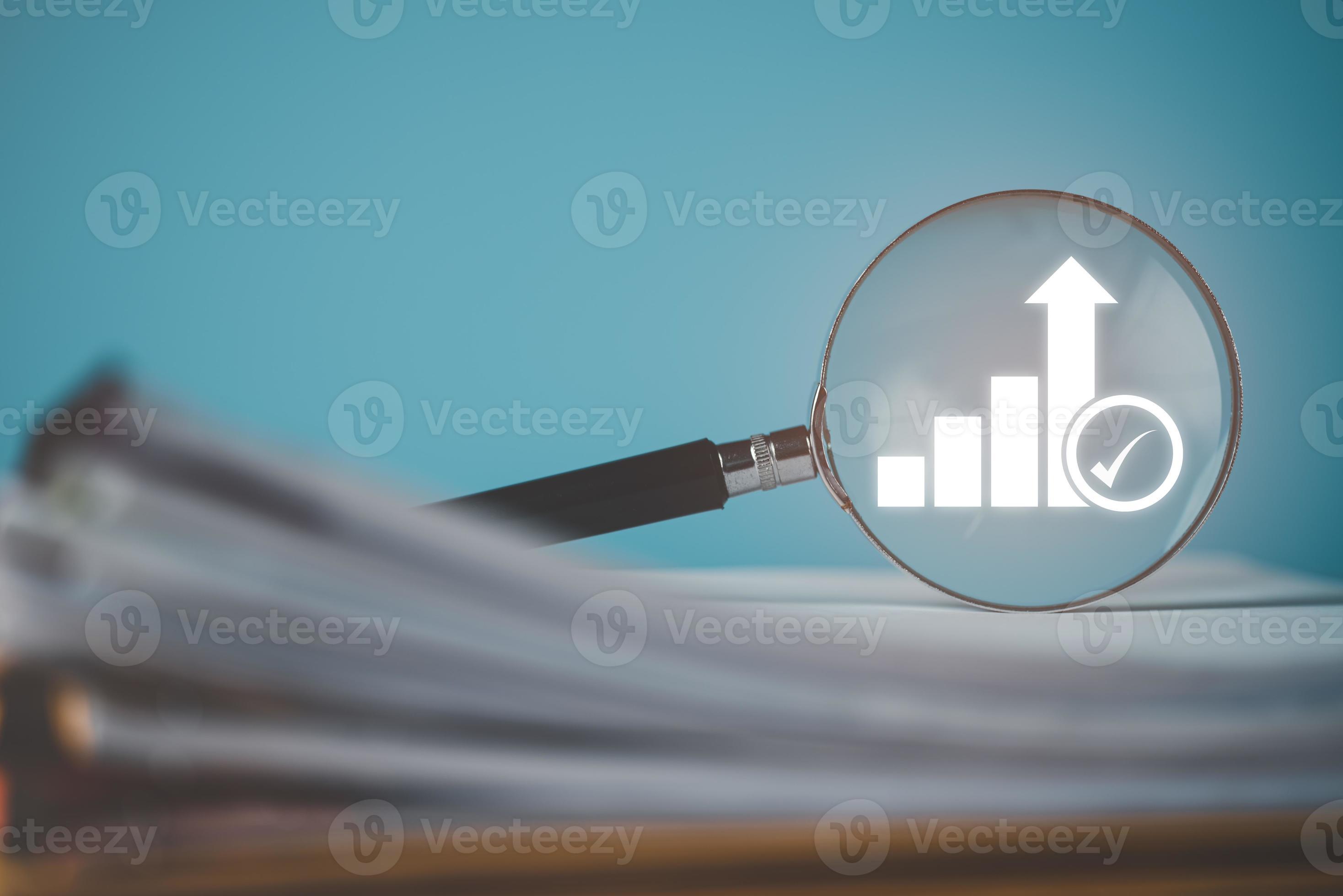 A magnifying glass is placed on the document,Show business growth and ...