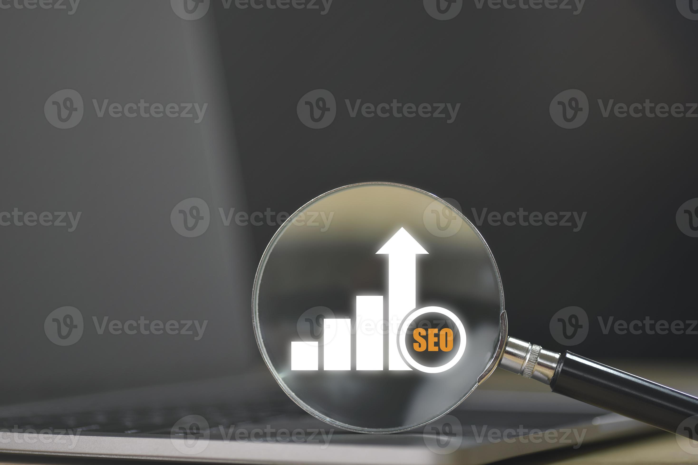 Magnifier shows growth graph and shows SEO concept, optimization ...
