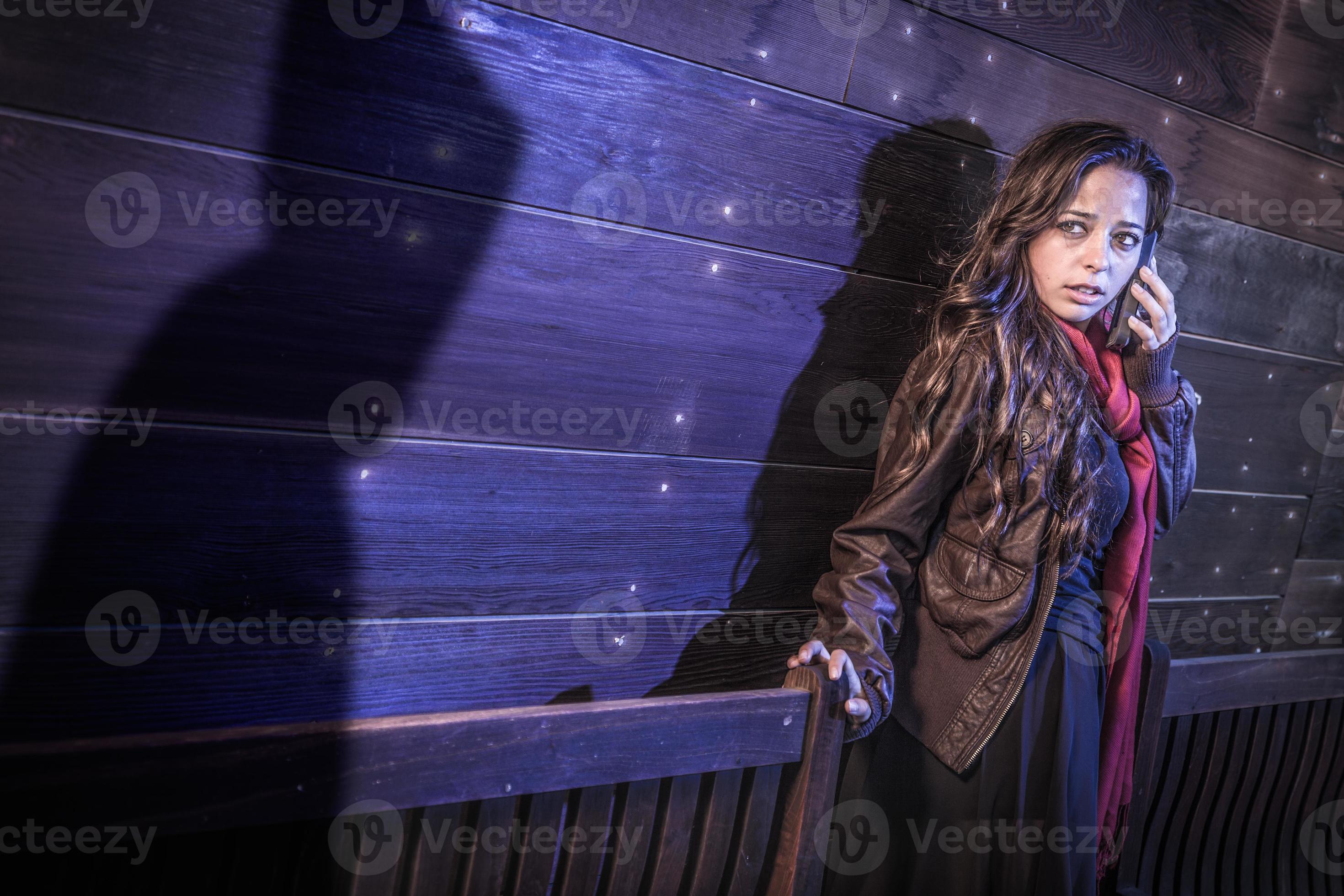 Scared Young Adult Woman Uses Cell Phone As Mysterious Male Shadow Figure Lurks Nearby 16444830 ...