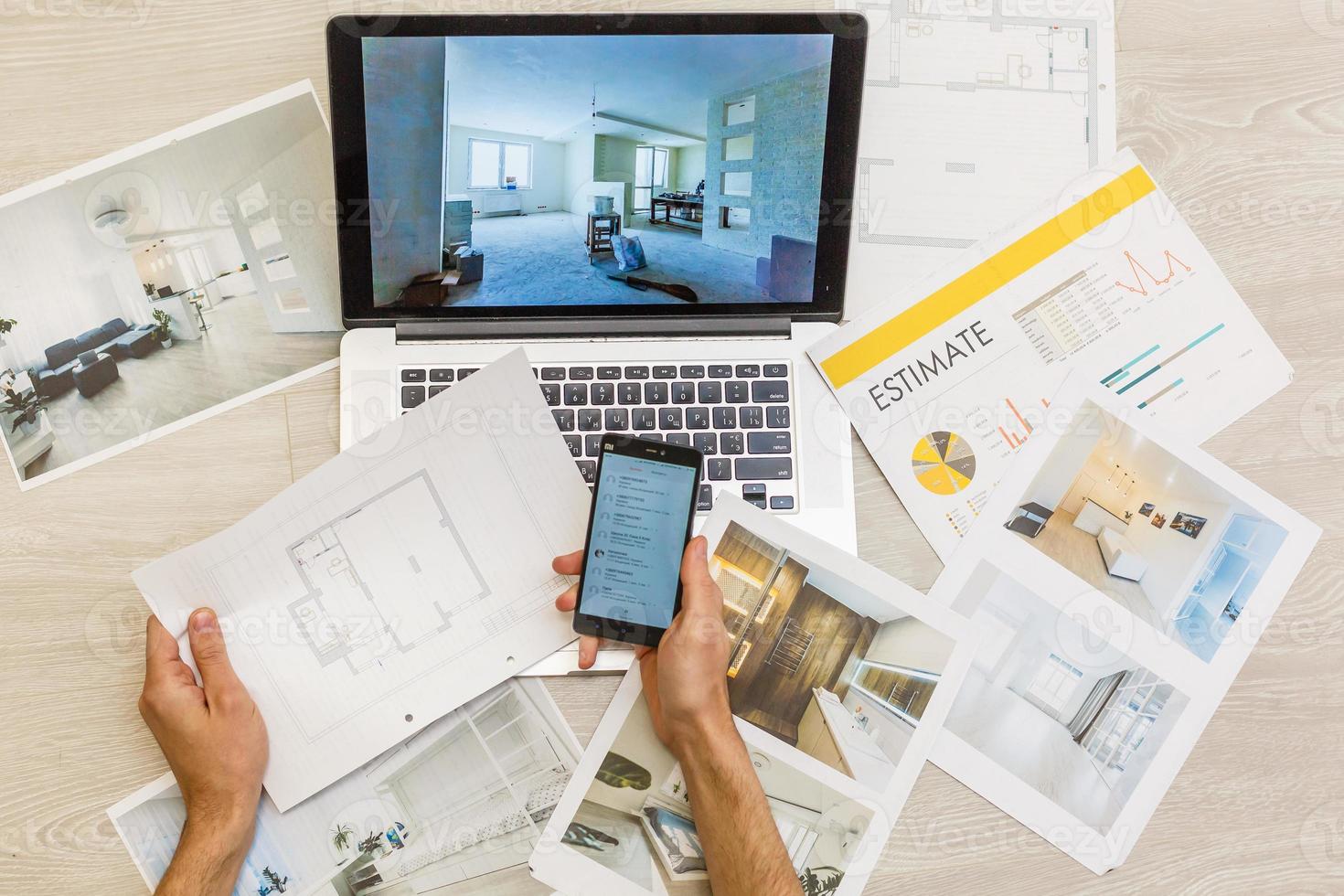 top view of Designer hand working with laptop computer on wooden desk as responsive web design ...