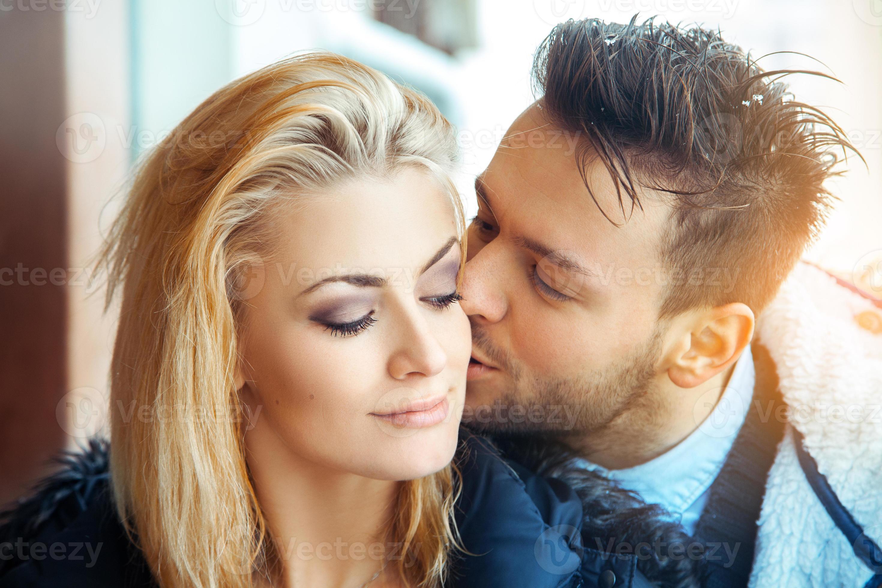 Fashion Portrait Of Couple In Love Man Kissing His Woman In Cheek