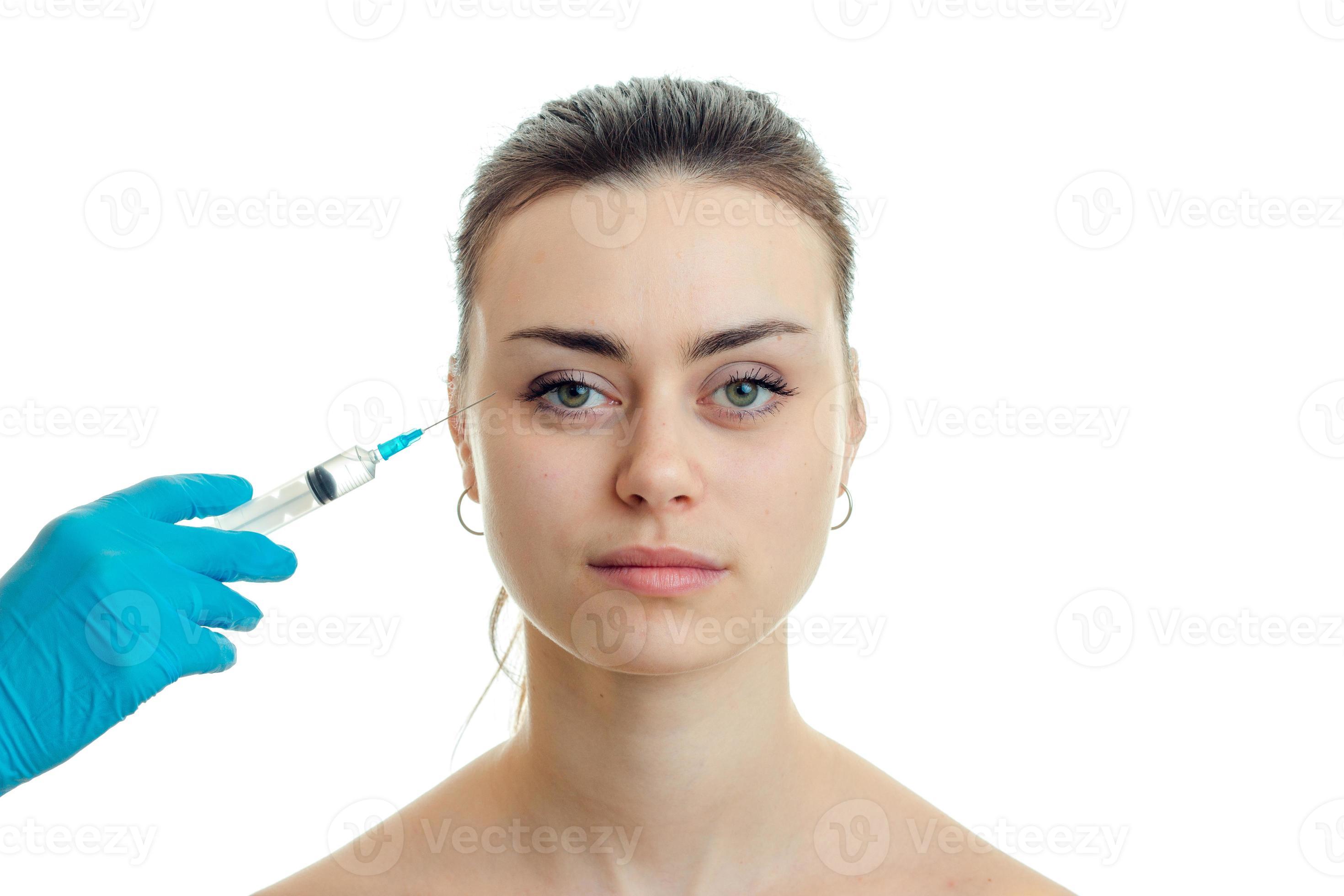 dermatologist injects a vaccine on the face of a young girl have close ... dermatologist injects a vaccine on the face of a young girl have close ...