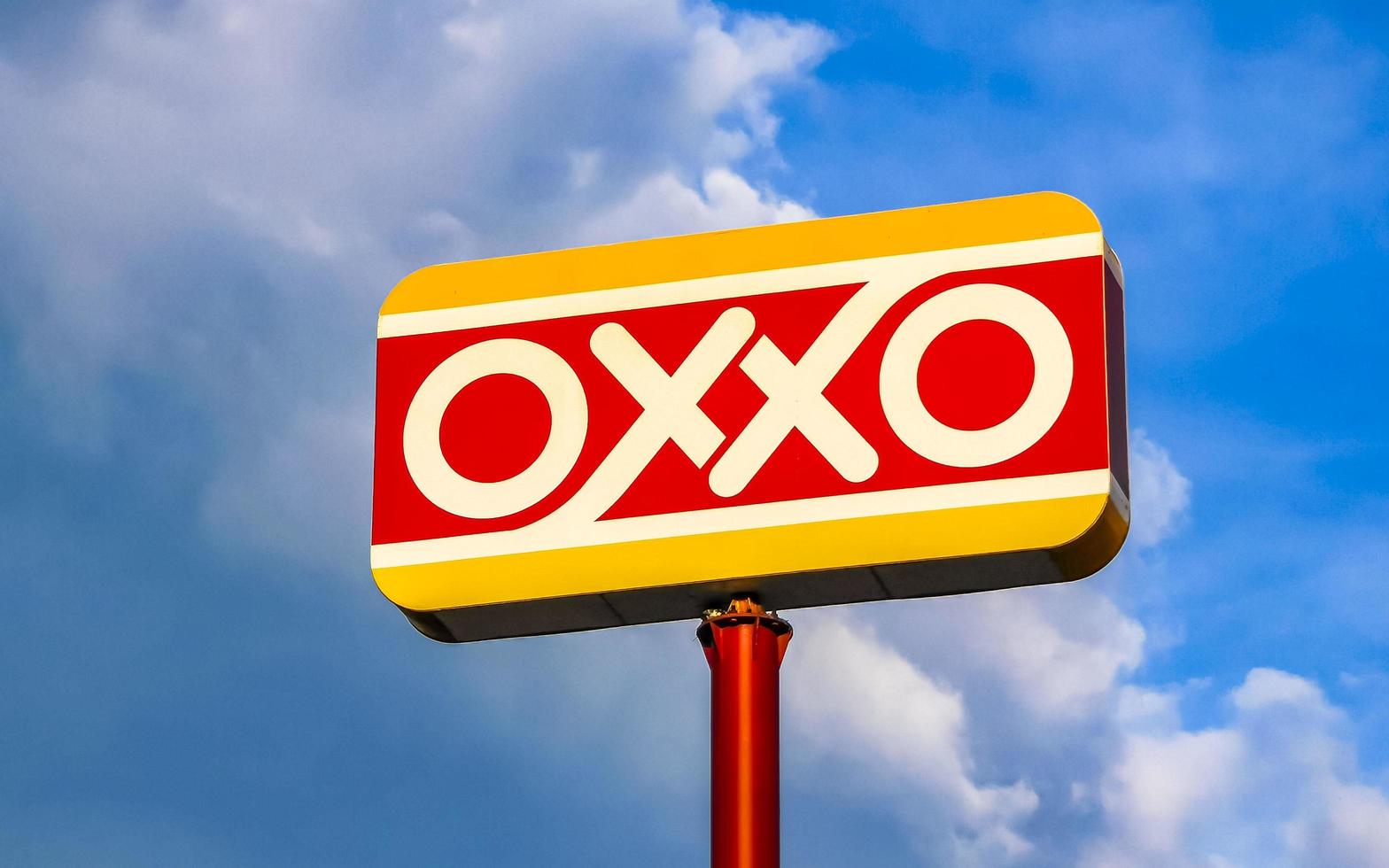 Puerto Escondido Oaxaca Mexico 2022 Oxxo supermarket logo blue cloudy sky Puerto Escondido ...
