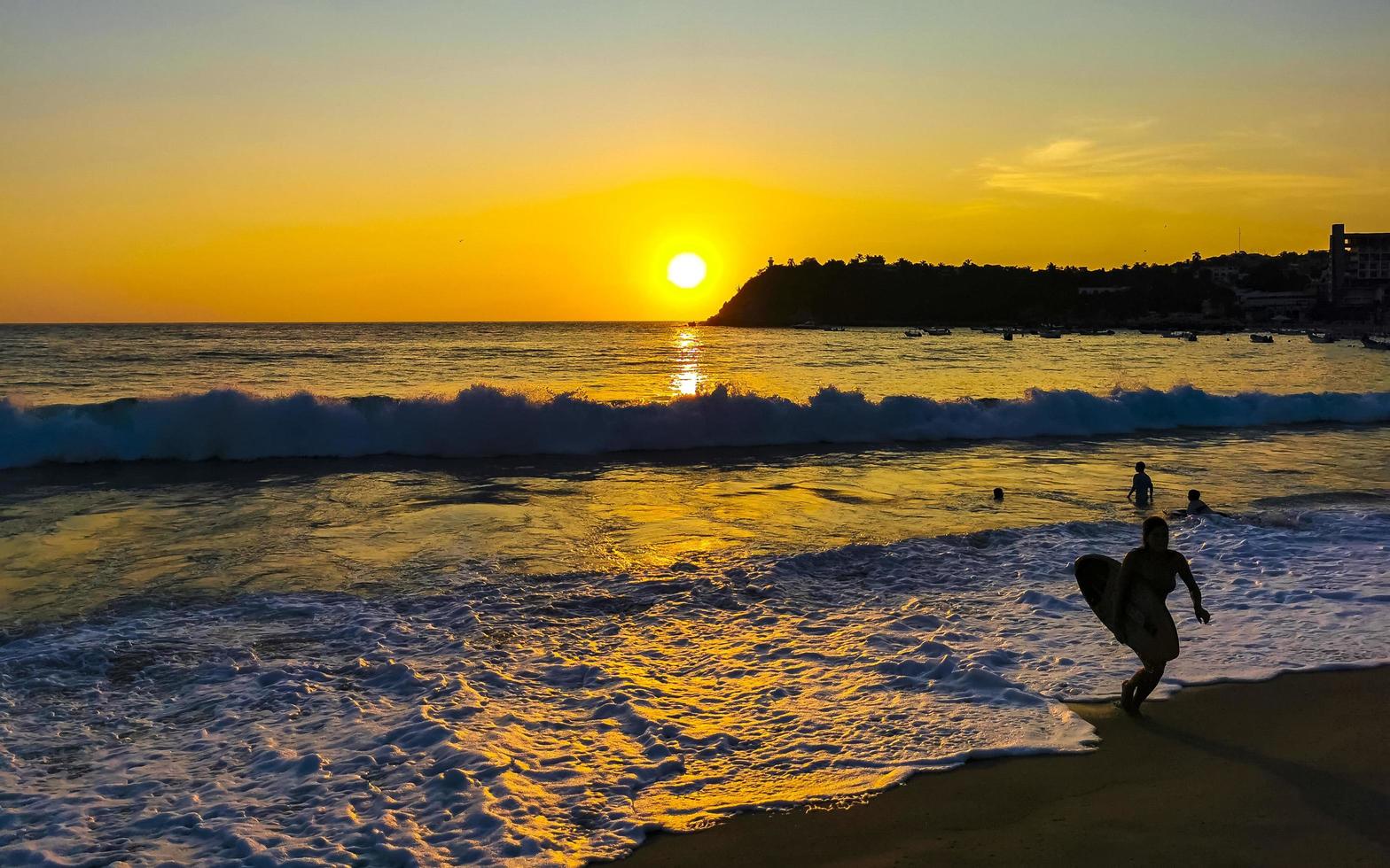 Colorful golden sunset big wave and beach Puerto Escondido Mexico ...