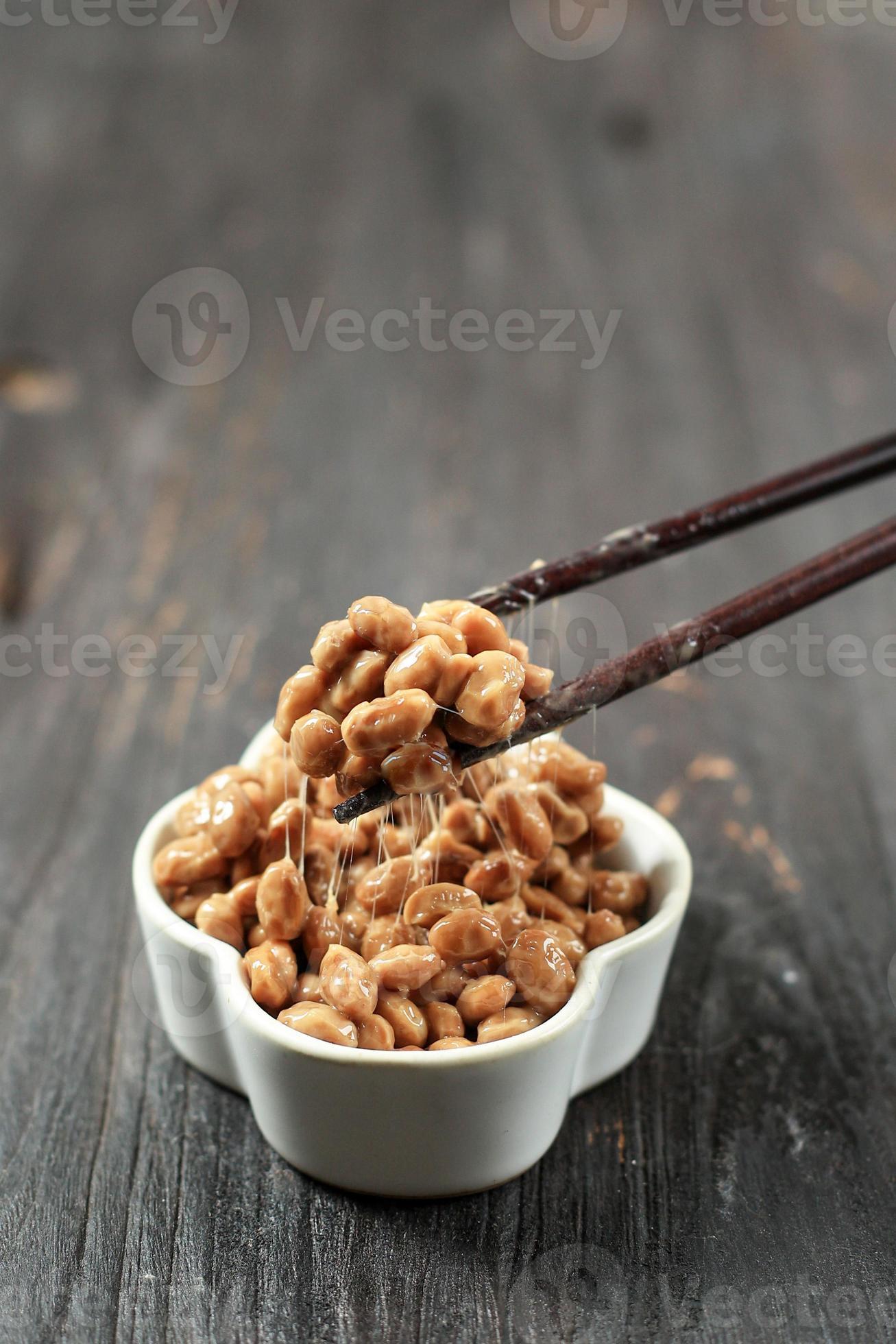 Natto Lifted with Chopstick. Natto is Japanese Fermented Sticky Soy Beans with Stinky Smell ...