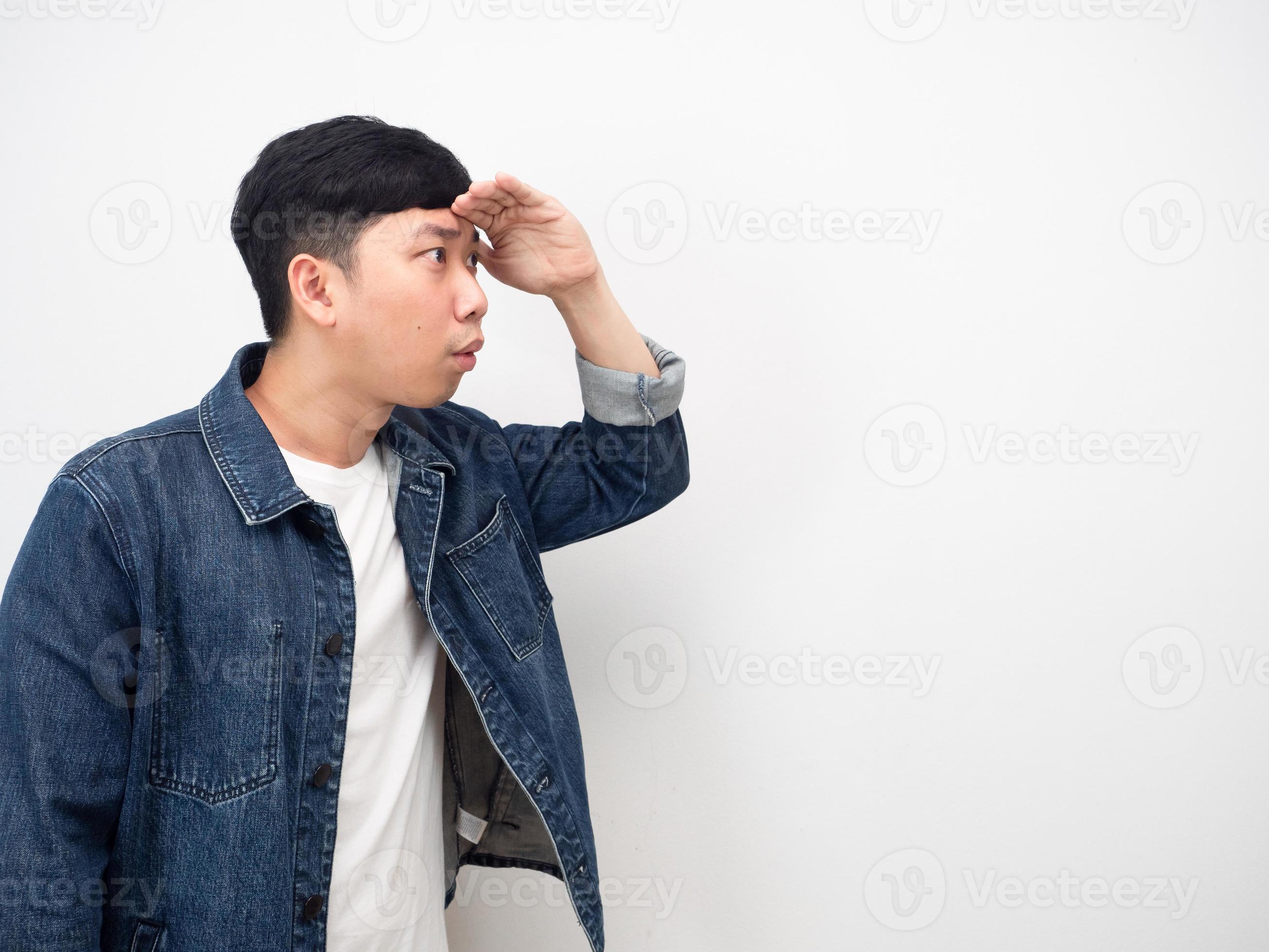 Side view asian man jean shirt gesture hand over head excited looking ...