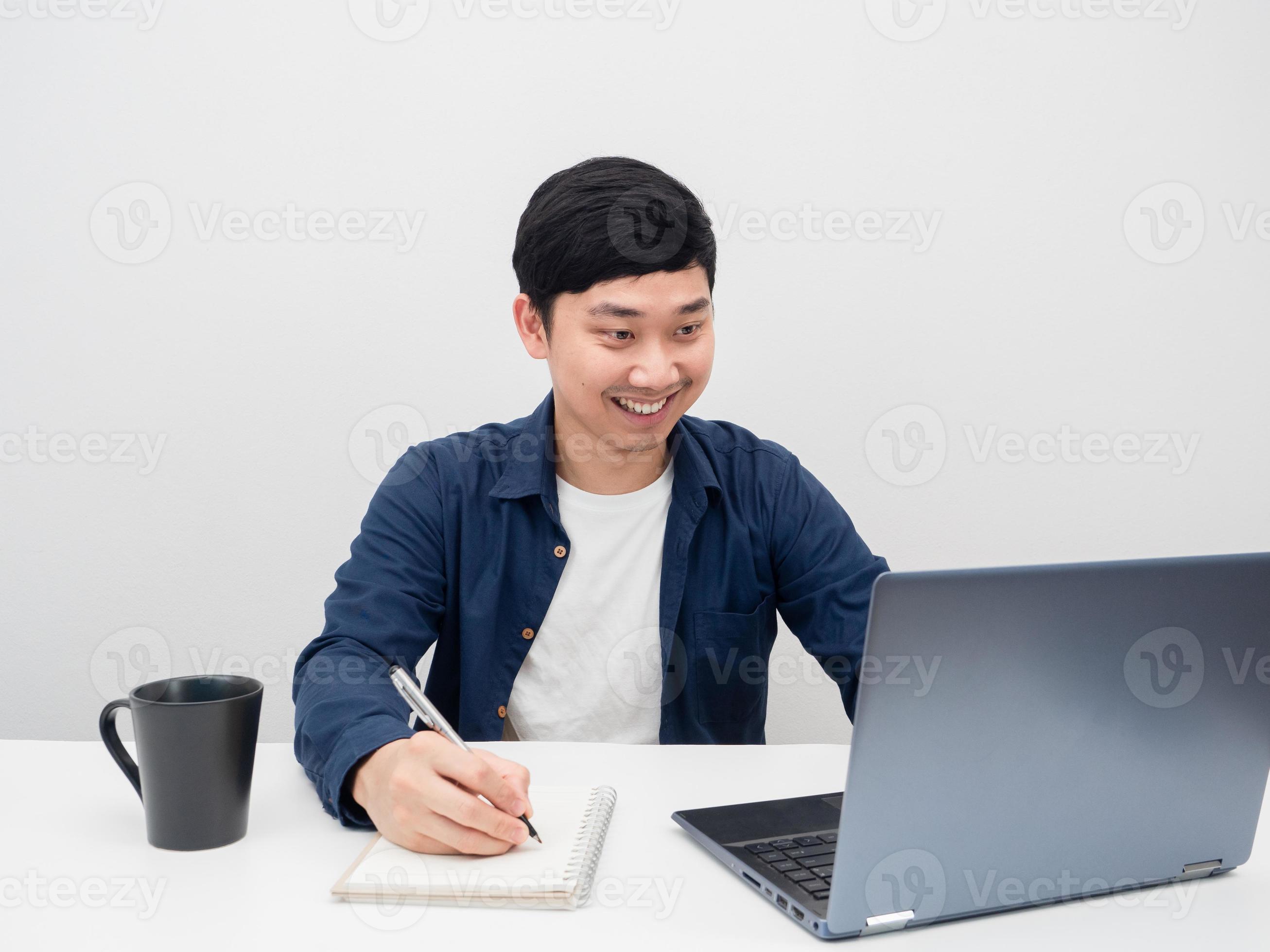 Man working on the desk with laptop smiling white background 16686855 ...