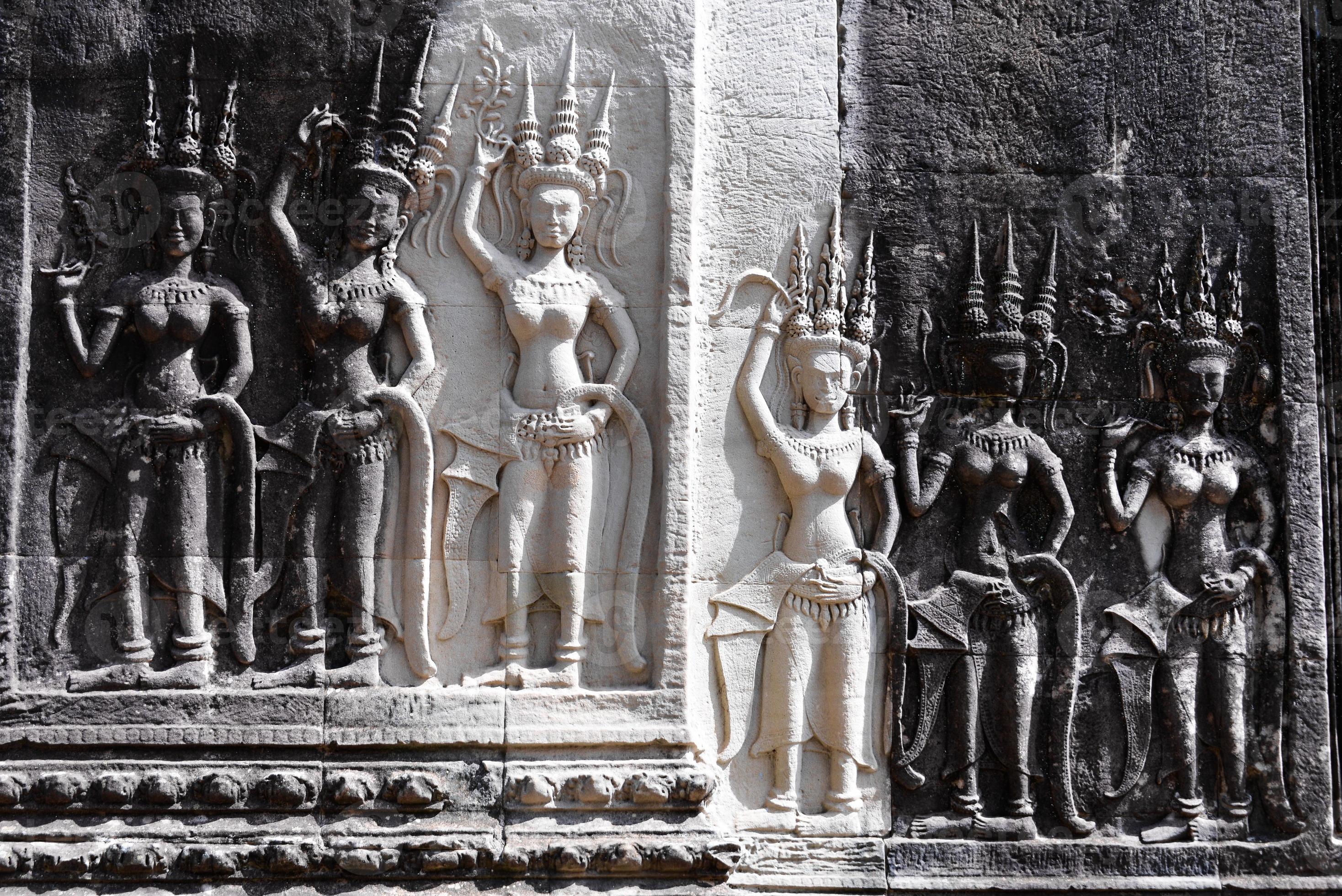 Detail of stone carvings of Apsara is a beautiful and seductive girl of Hindu mythology at ...