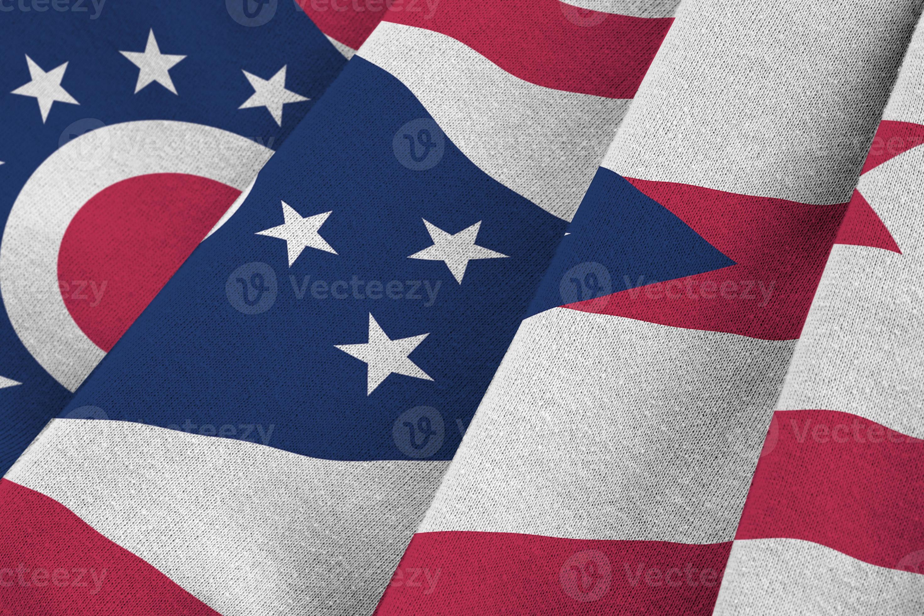 Ohio US state flag with big folds waving close up under the studio light indoors. The official ...