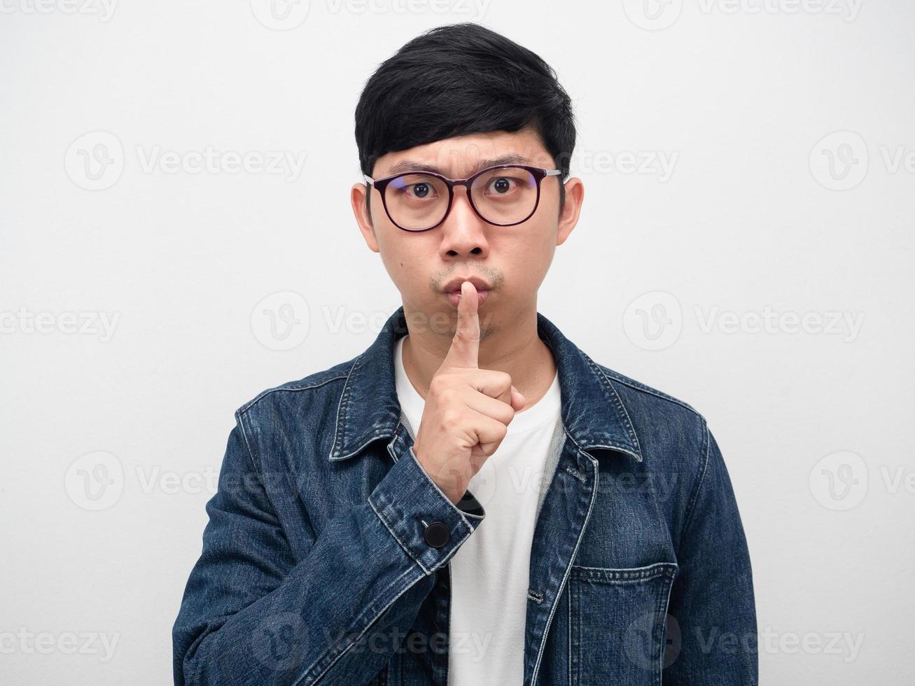 Man jeans shirt wearing glasses serious face finger close mouth shush for quiet 16790676 Stock ...